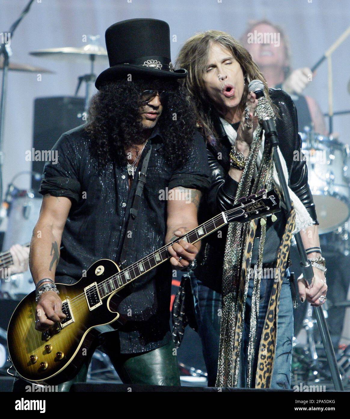 Musician Slash, left, and musician Steven Tyler perform during The 4th ...