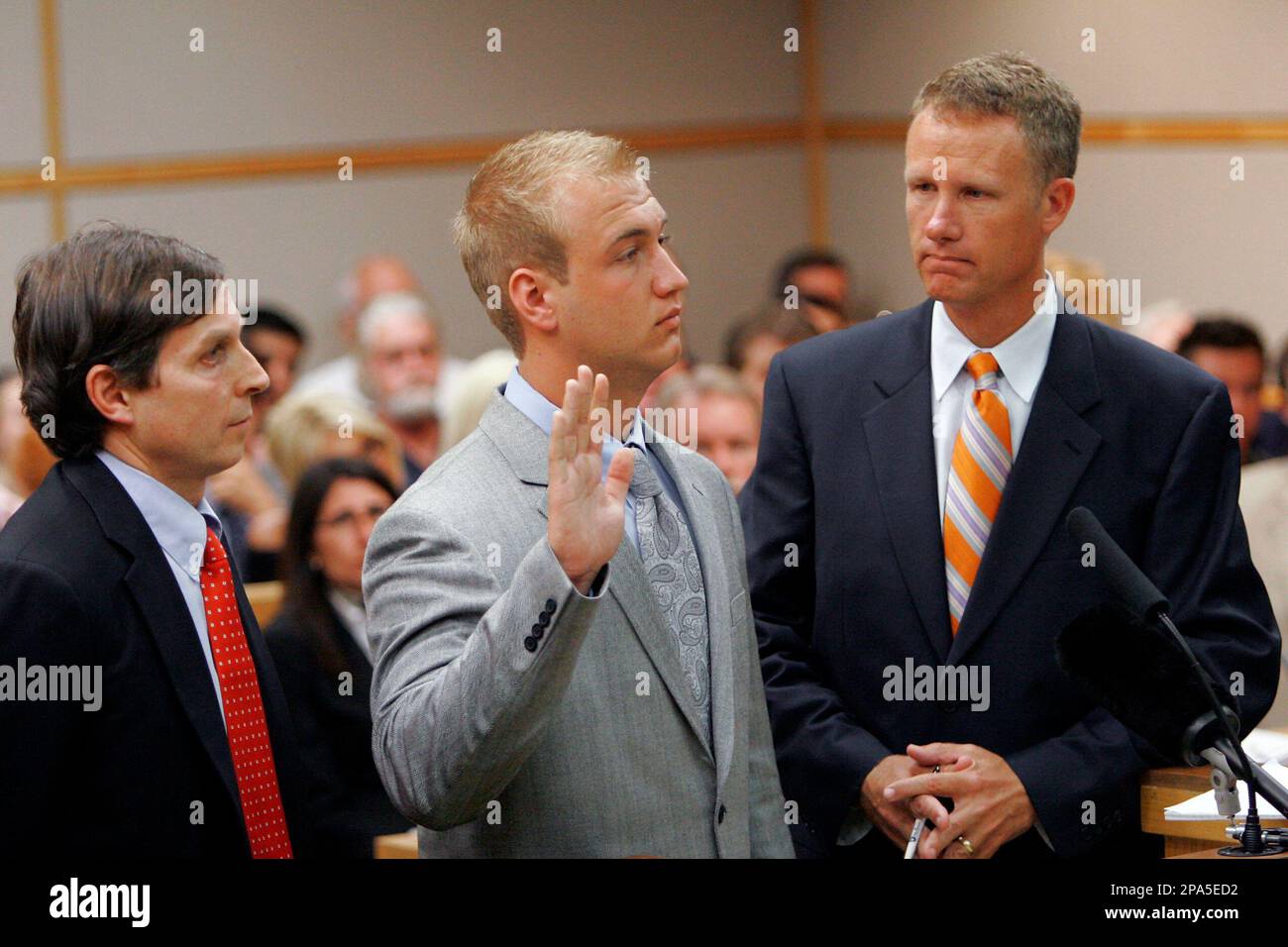 Flanked by his attorneys Morris Sandy Weinberg, left, and Kevin Hayslett, Nick Bollea takes the ...