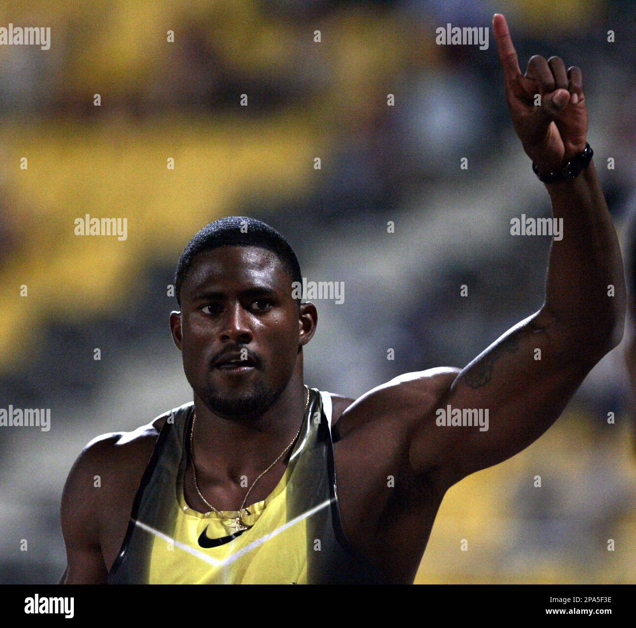 U.S. Olympics track and field team member David Oliver celebrates after ...