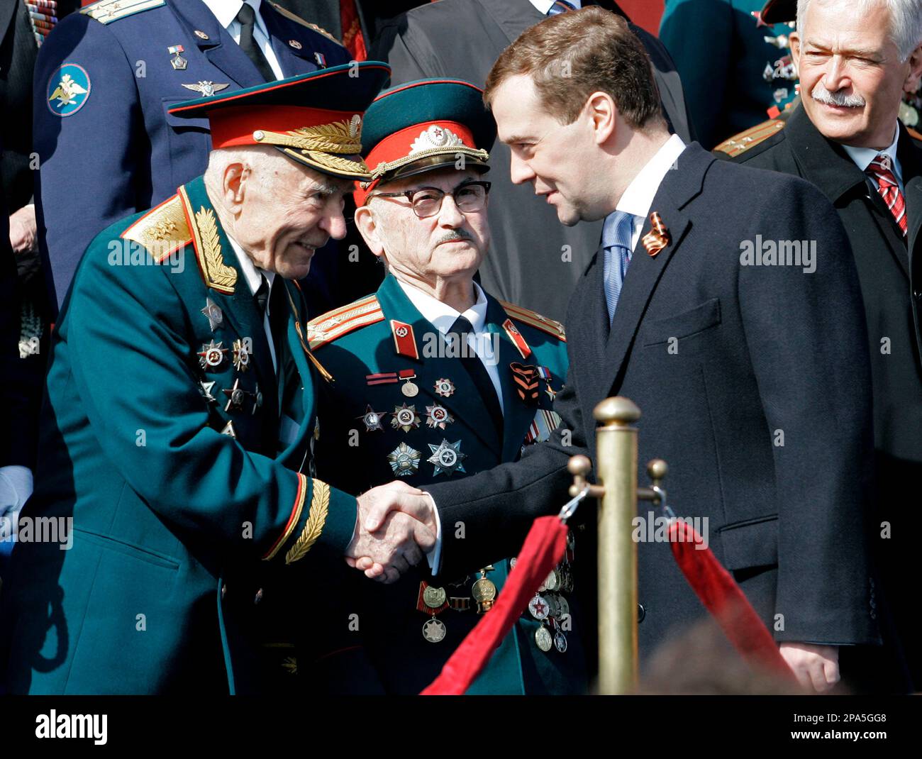 Russian President Dmitry Medvedev, right, shakes hands with World War ...