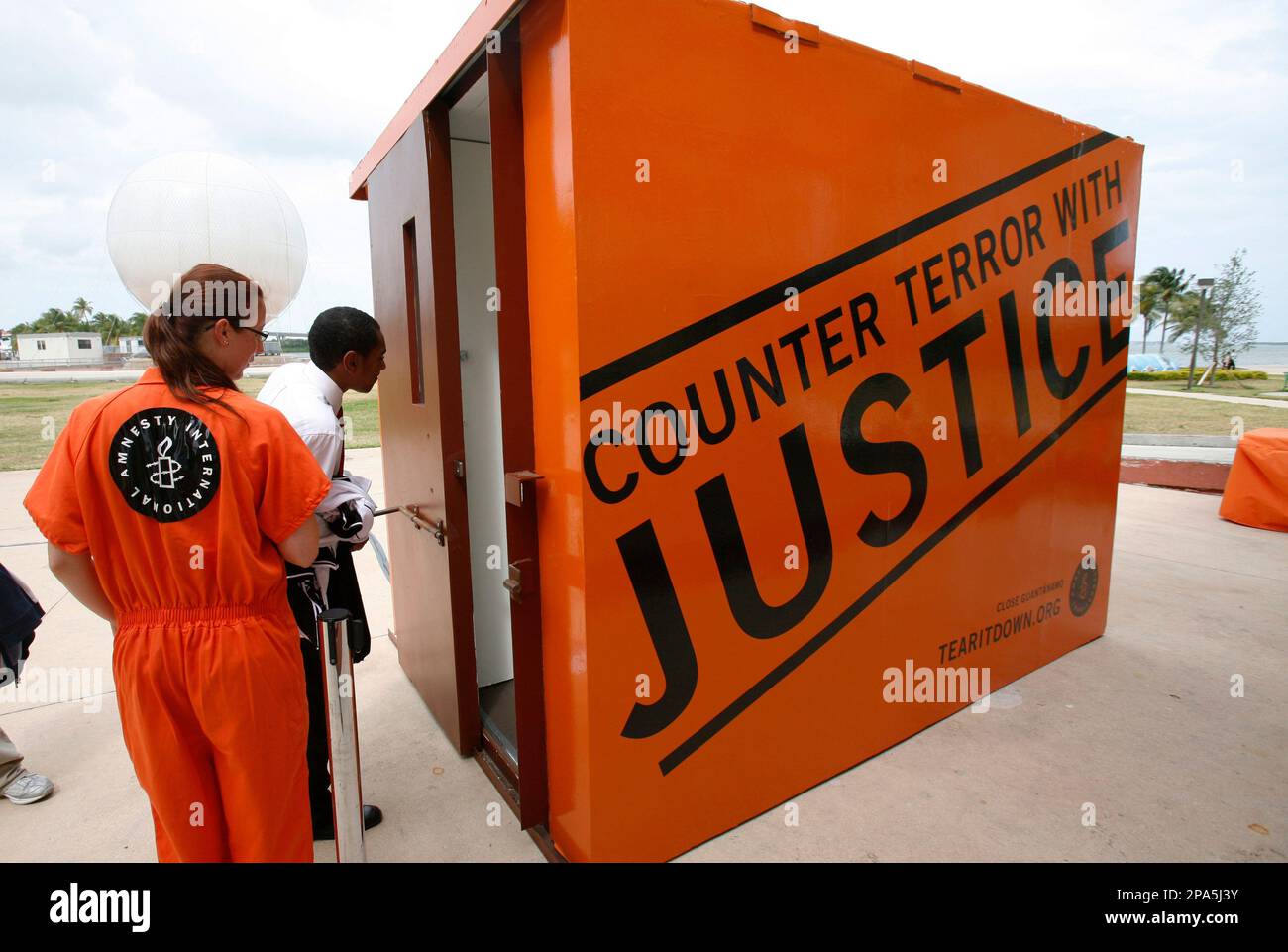 Brandon West looks inside a life-size Guantanamo prison cell as Karen ...