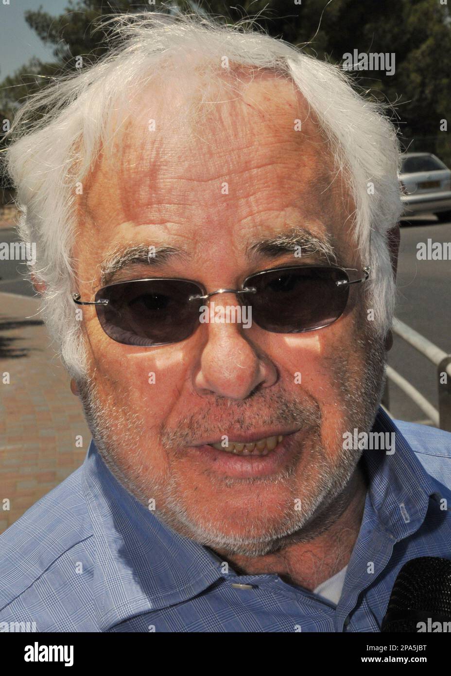 American businessman Moshe Talansky talks to reporters as he leaves his ...