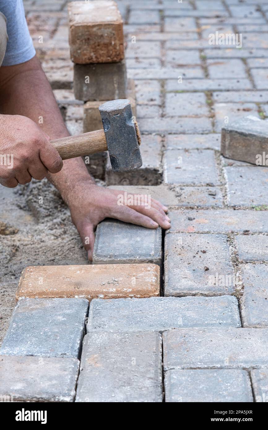 Brick tapping hi-res stock photography and images - Alamy