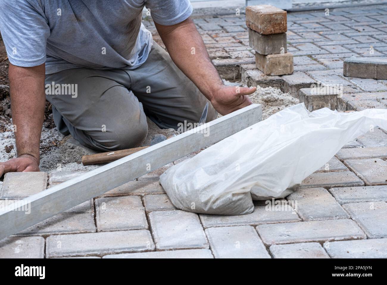 Construction worker is holding a level tool hi-res stock photography ...
