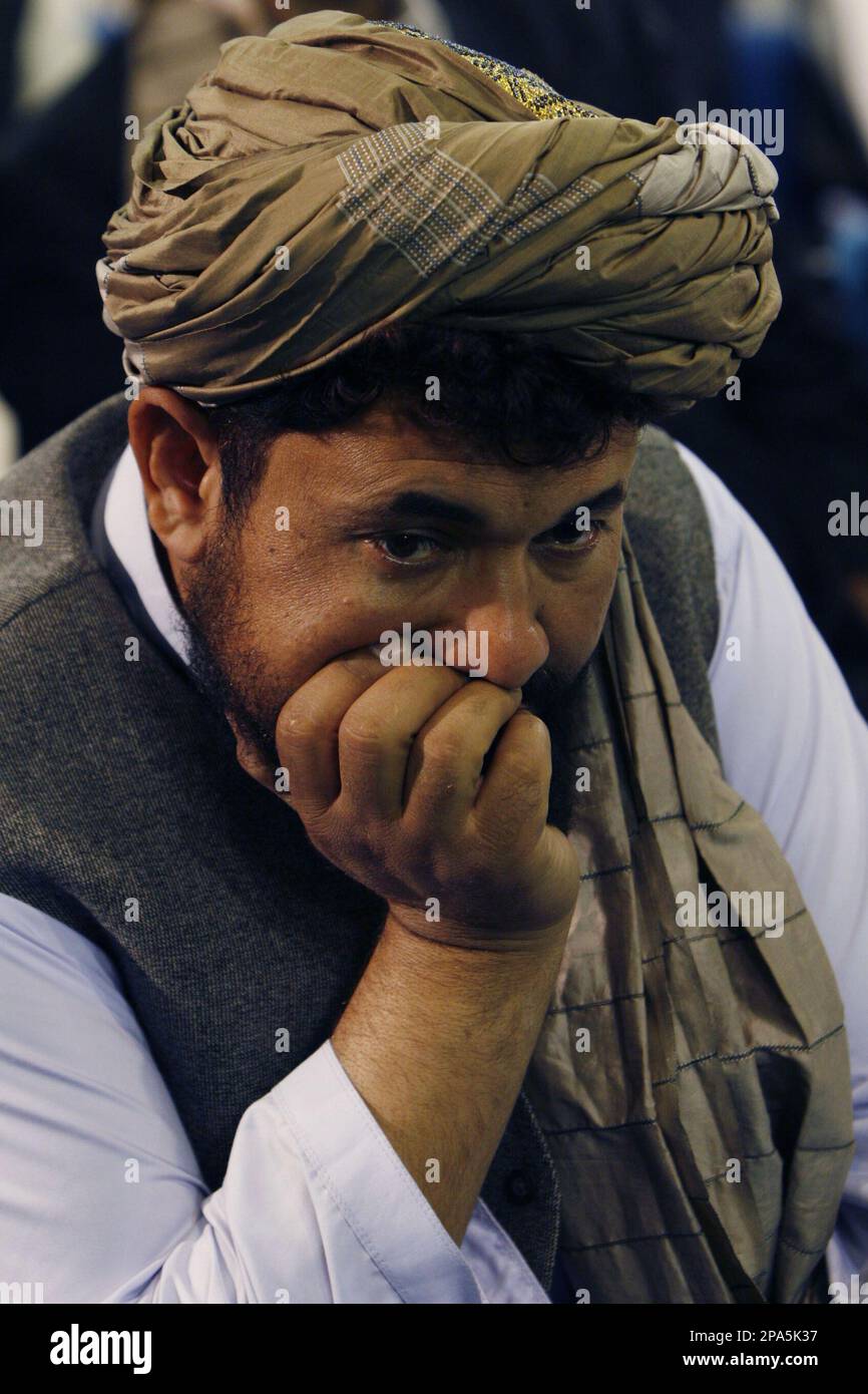 An Afghan ethnic Pashtun man listens during a gathering in the city of ...