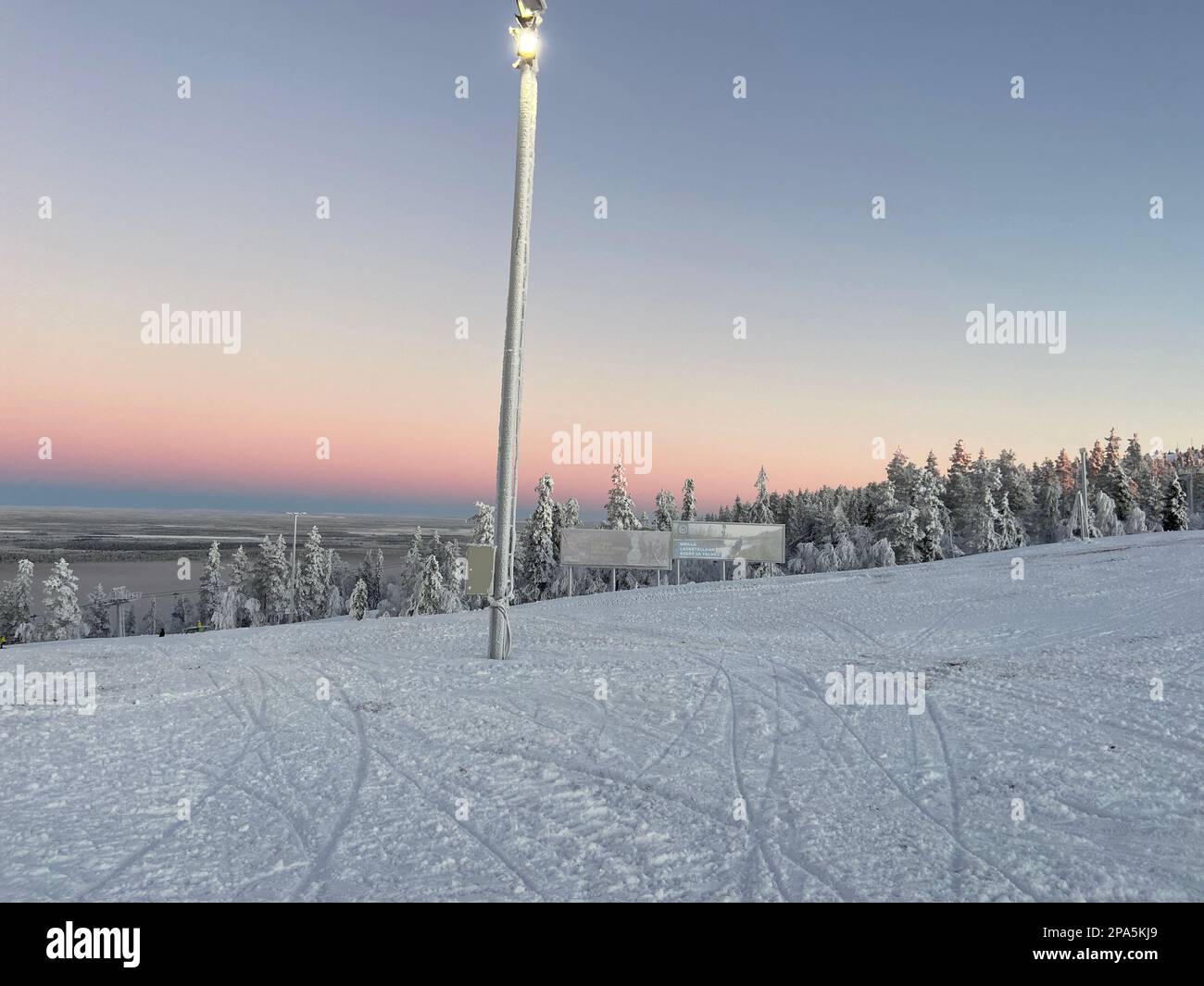 Evening mood and colorful sunset seen from the slopes in Levi Stock ...
