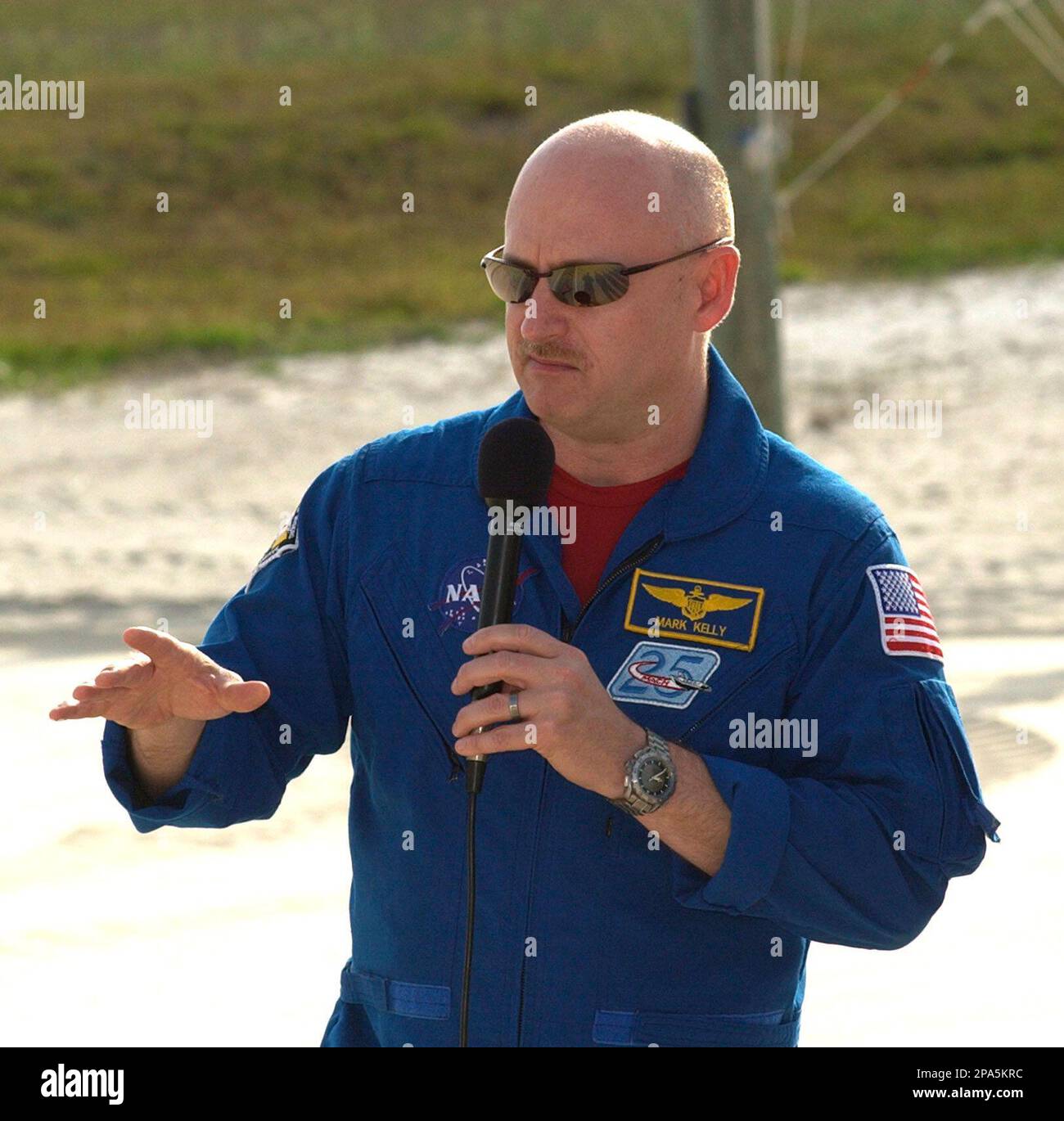 Space shuttle Discovery commander Mark Kelly addresses the media during ...