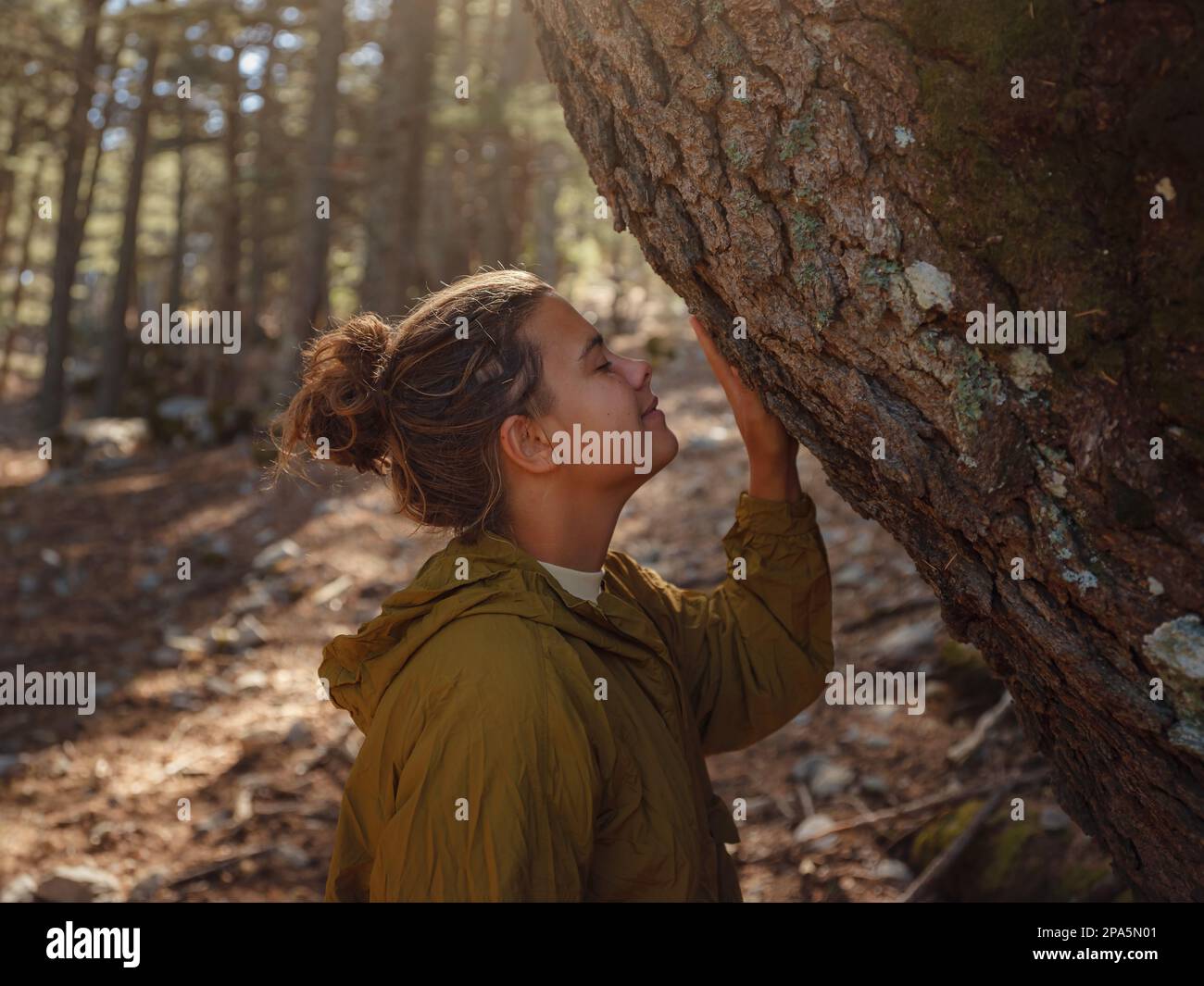 caucasian woman enjoys being in nature, beautiful forest in mountains ...