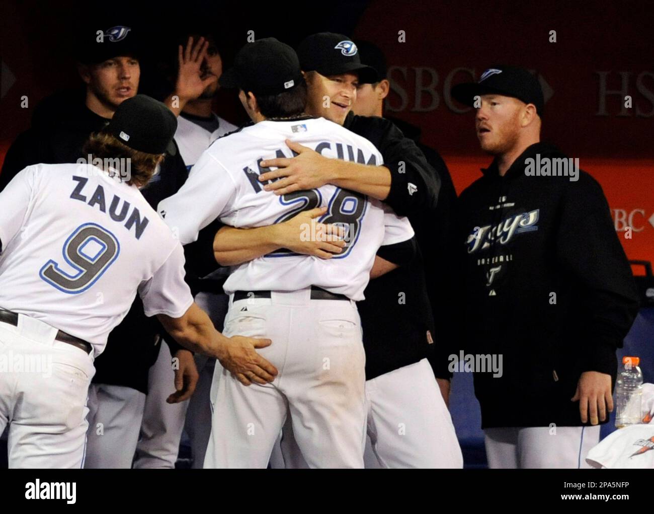 Toronto Blue Jays pitcher Shaun Marcum (28) hugs teammate A.J. Burnett ...