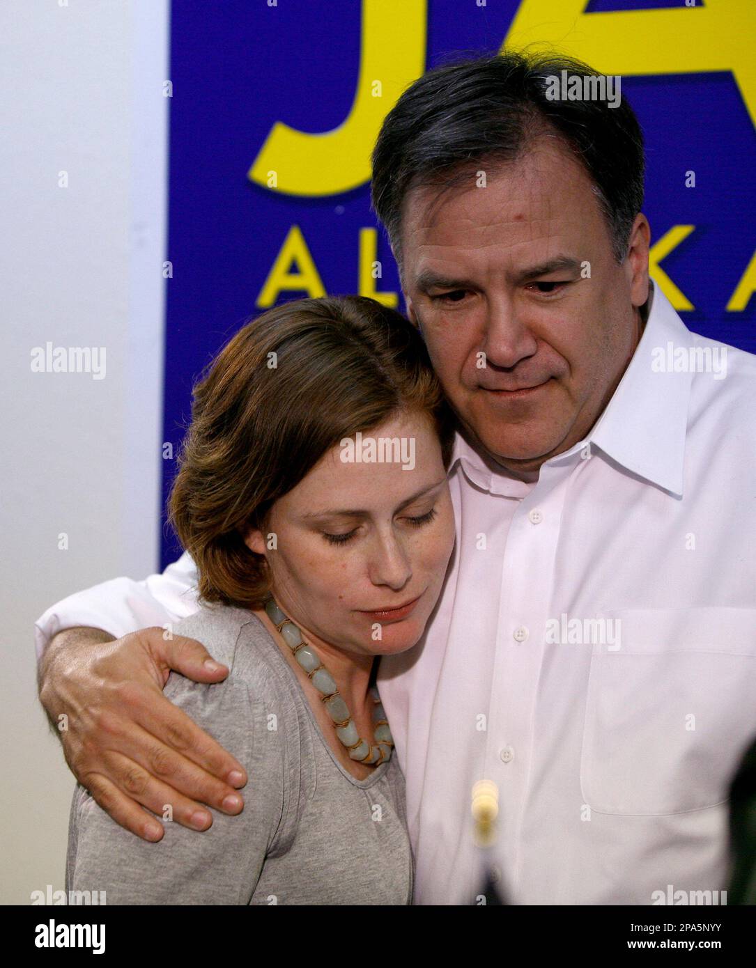 Jake Metcalfe hugs his wife Moira Smith after he announced that he is ...