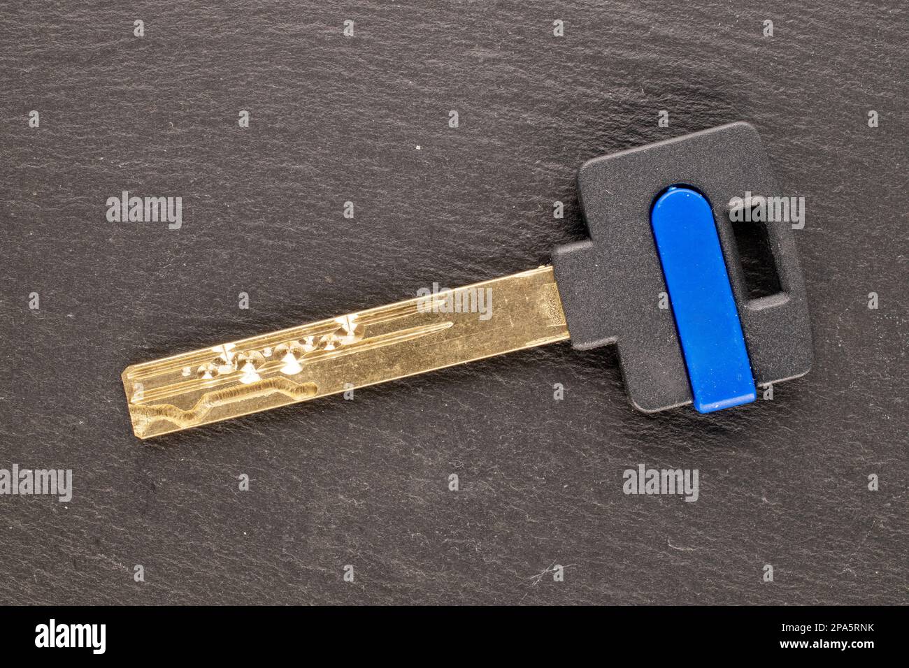 One metal door lock key on slate stone, macro, top view Stock Photo - Alamy