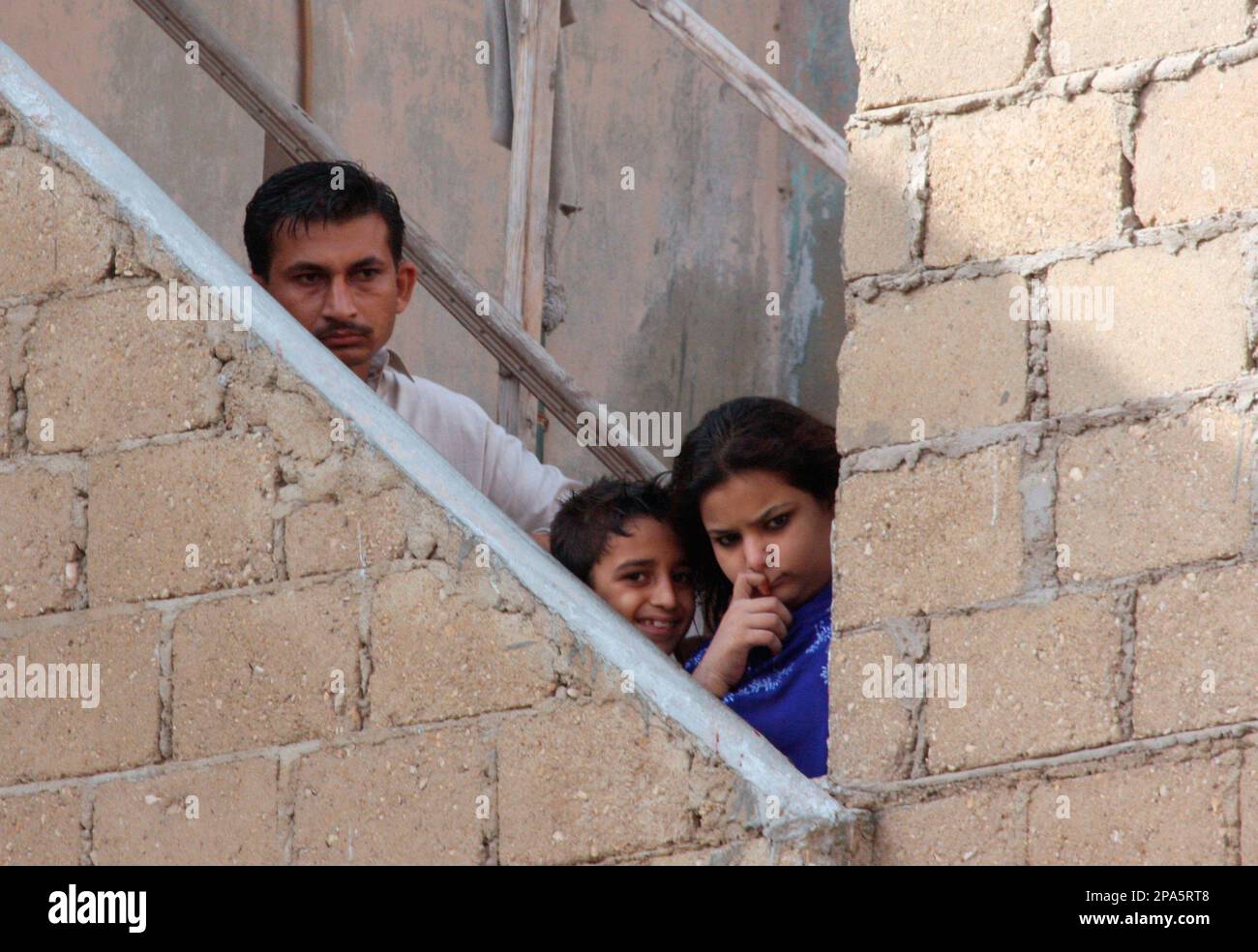 Pakistani residents living in a troubled neighborhood in Karachi's ...