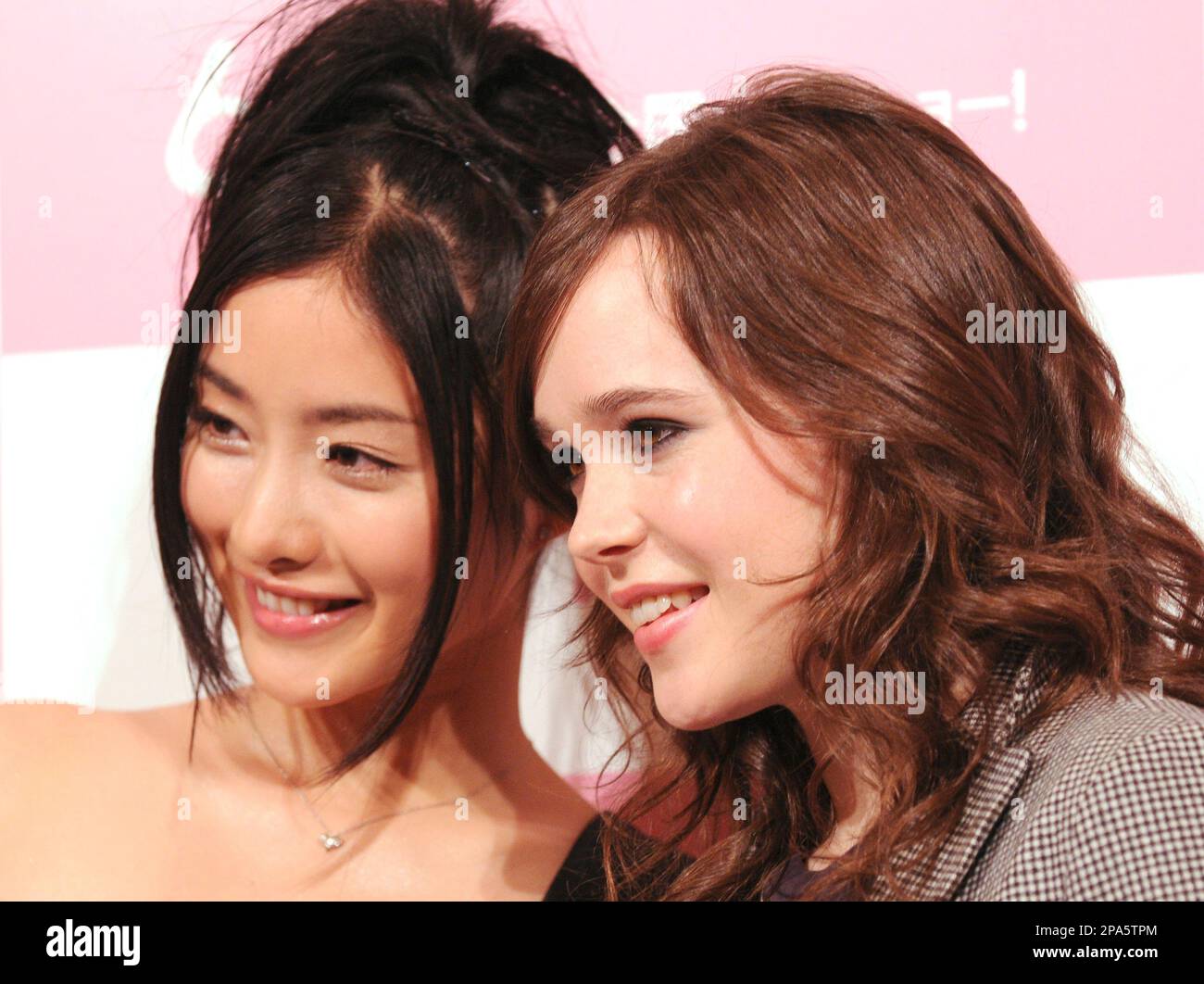 American actress Ellen Page, right, poses for photographers with ...