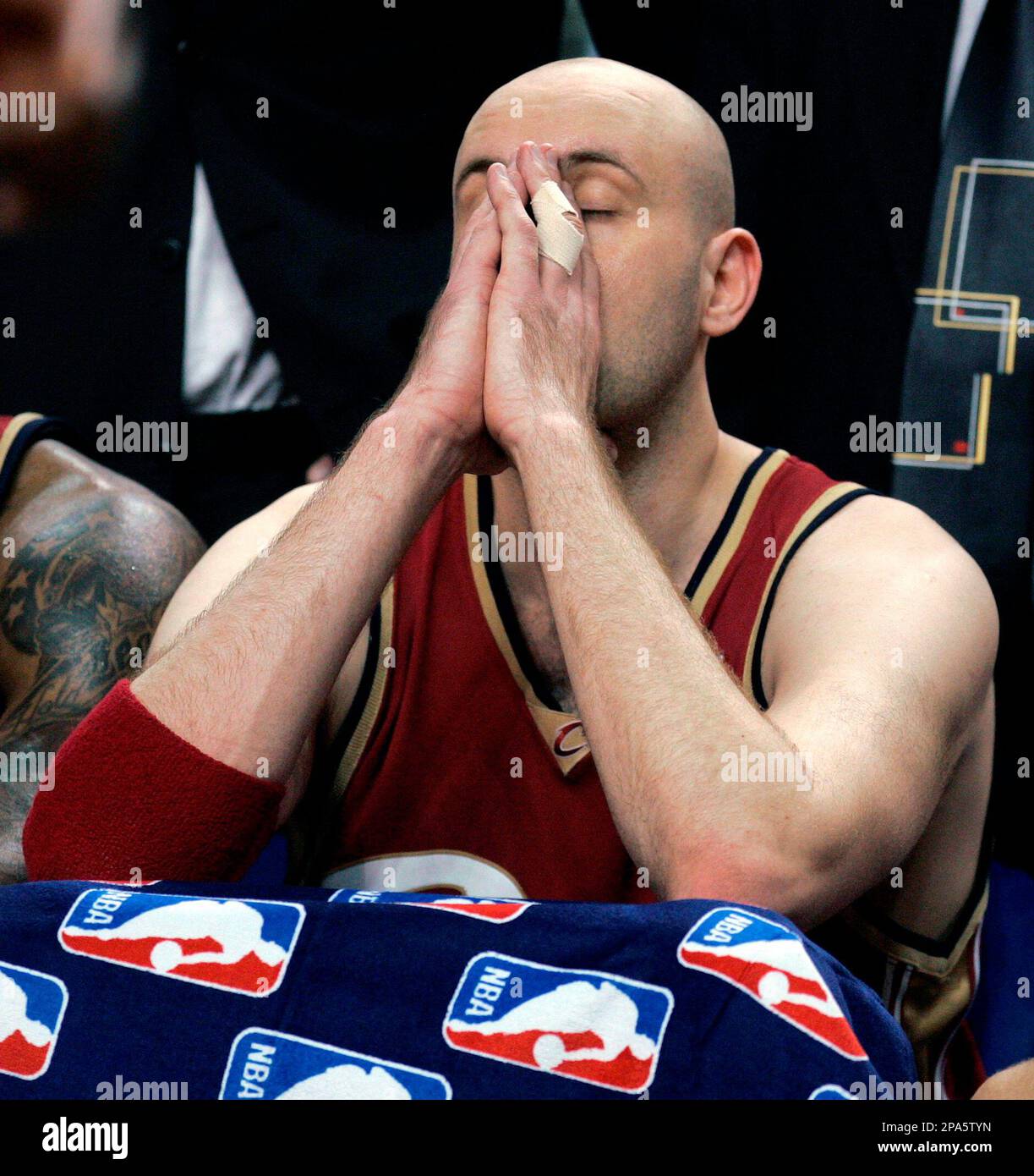 Cleveland Cavaliers' Zydrunas Ilgauskas, of Lithuania, sits on the ...