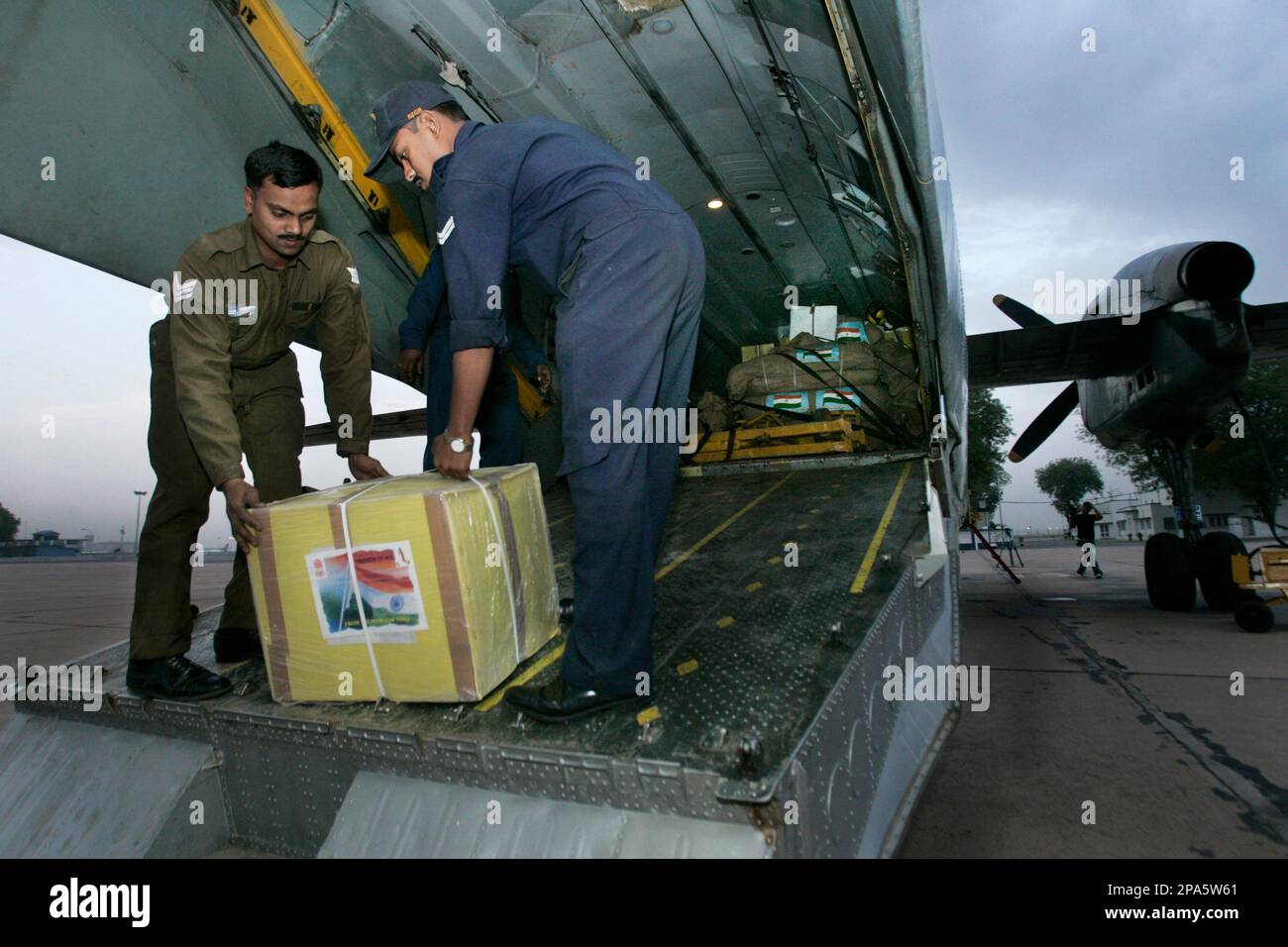 Indian Air Force personnel load relief supply, destined for cyclone affected Myanmar, on board ...