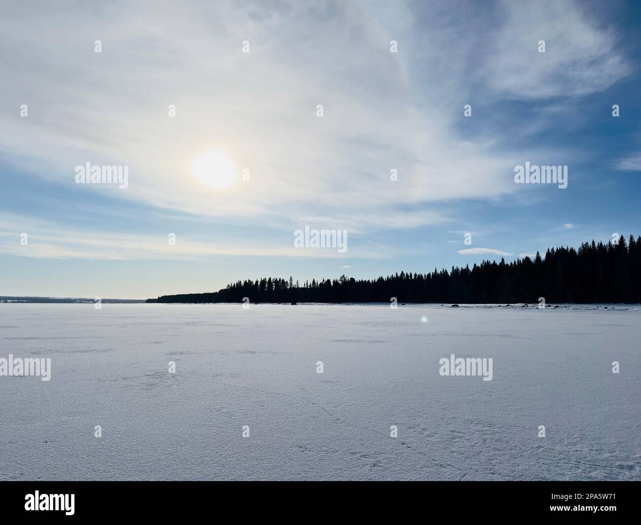 Winter landscape of a frozen lake in north Sweden Stock Photo - Alamy