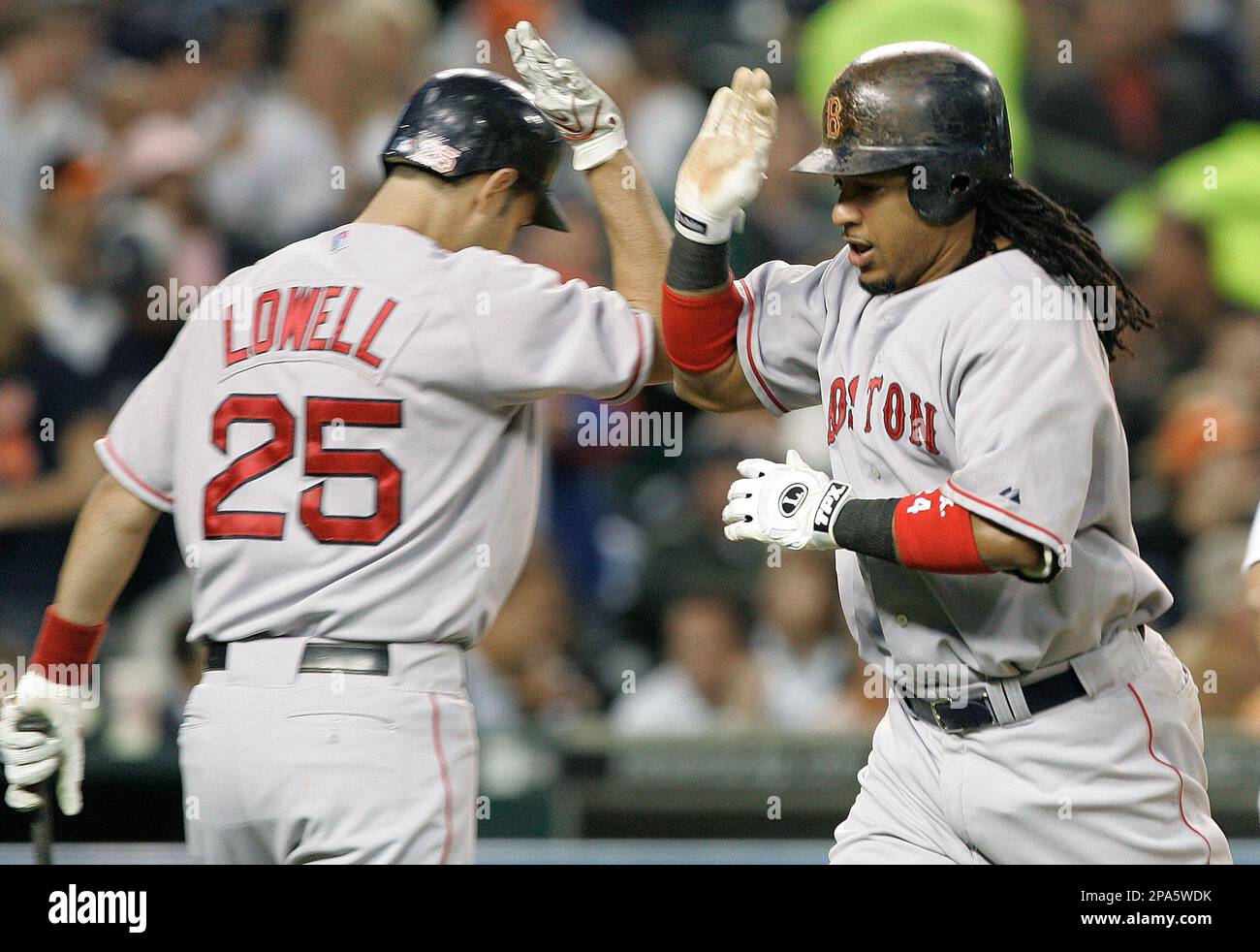 Boston Red Sox's Mike Lowell congratulates Manny Ramirez, right, after ...