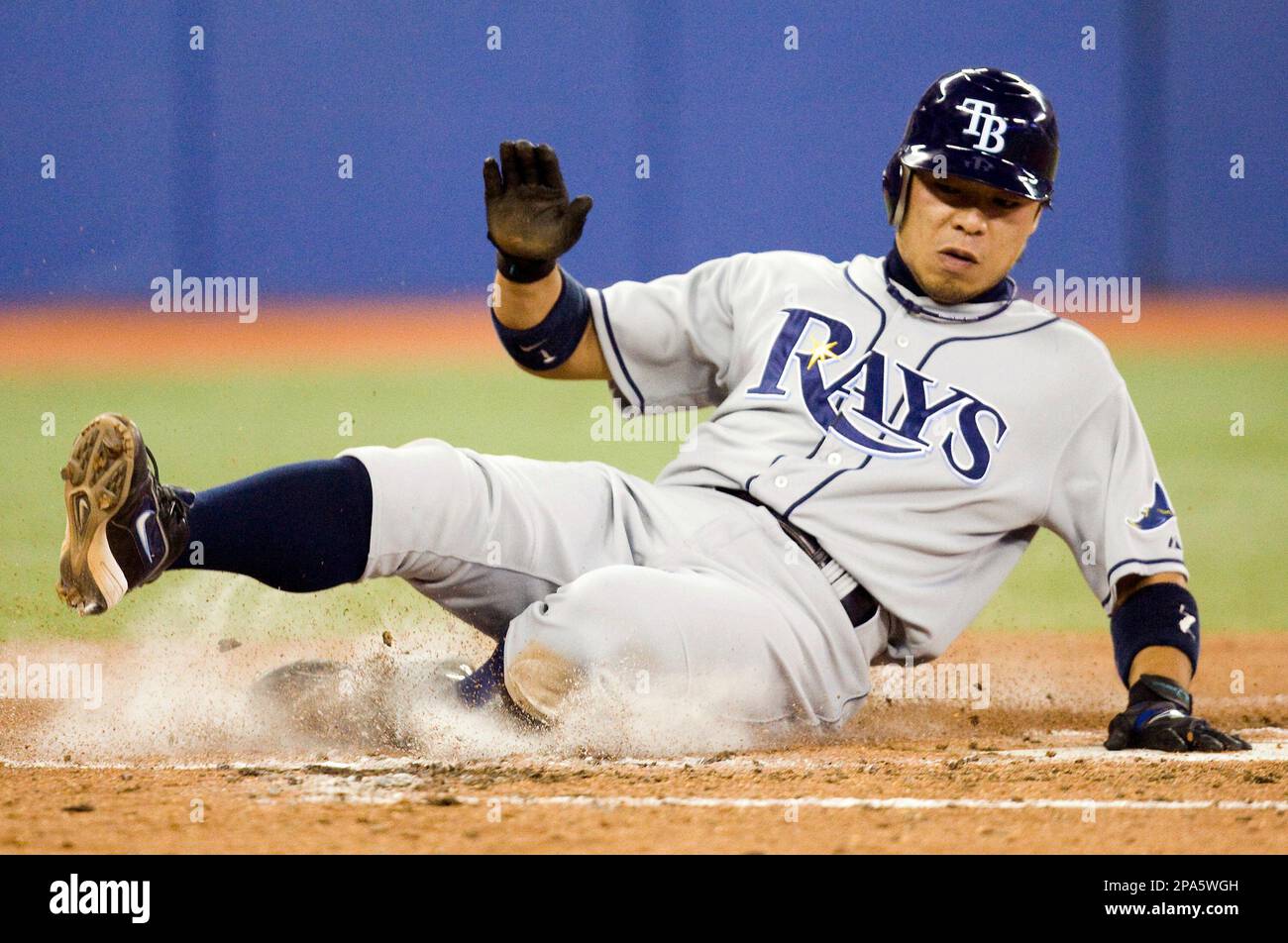 Tampa Bay Rays Akinori Iwamura, of Japan, slides in to score during the ...