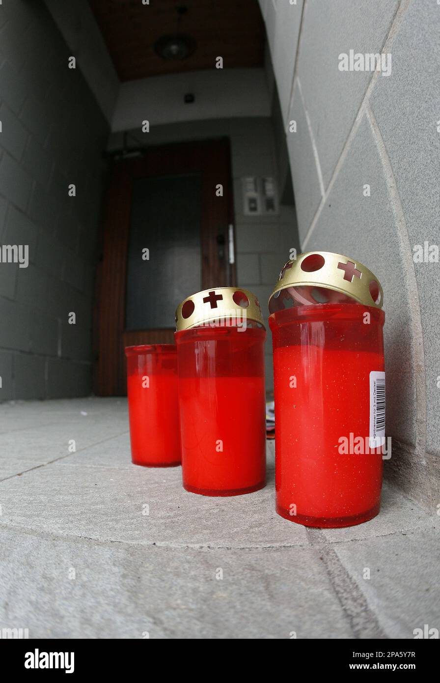 Candles are seen in front of the house in Amstetten, Lower Austria, on ...