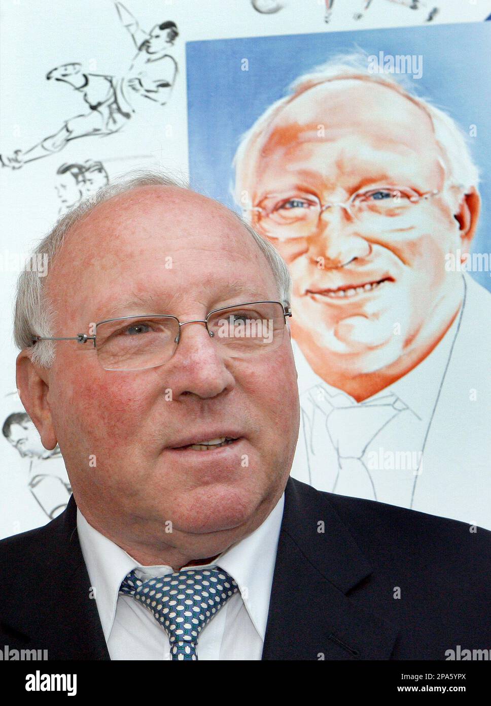 Former soccer player German Uwe Seeler poses in front of his portrait ...