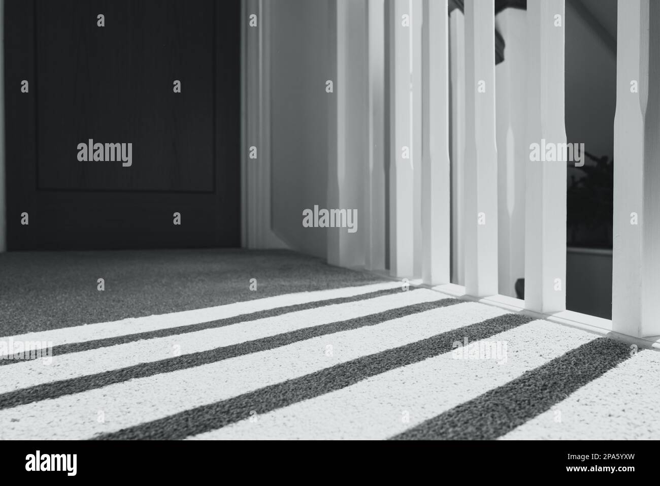 Abstract, monochrome view of dark shadows produced by skylight windows ...