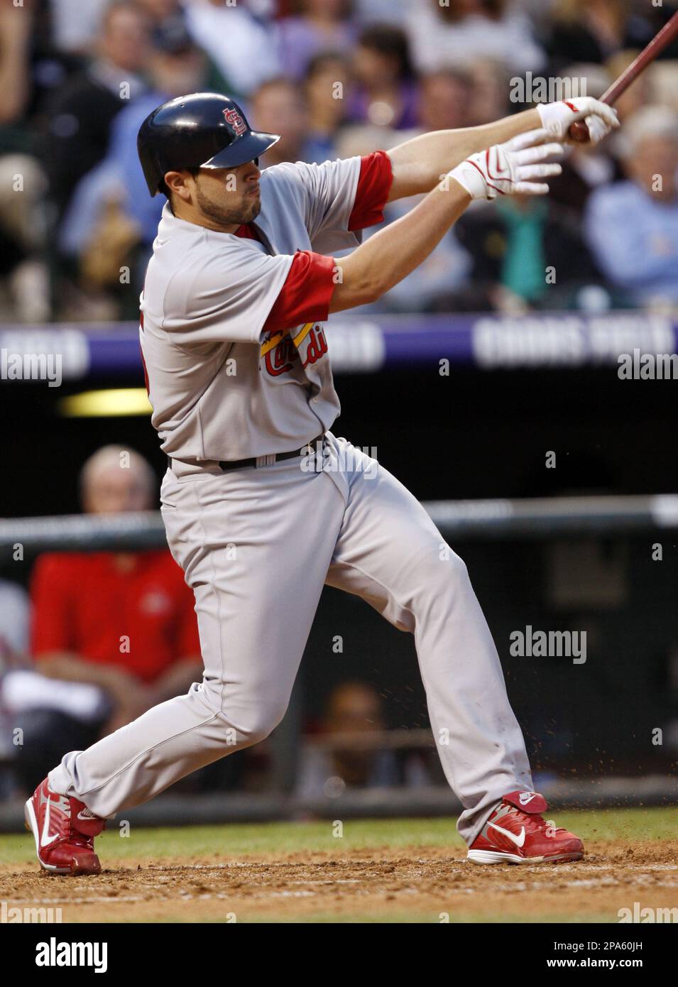 St. Louis Cardinals' Joel Pineiro follows through on a two-run double ...