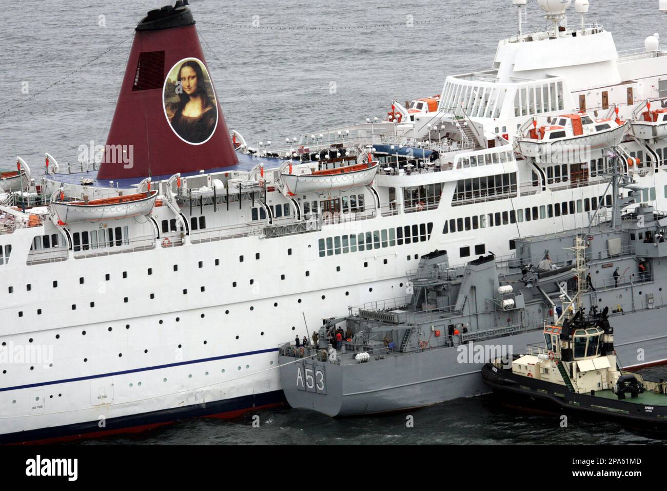 Passengers are evacuated from the stranded "Mona Lisa" cruise ship onto ...