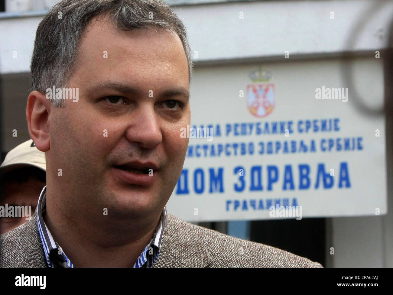 Serbian Defense Minister Dragan Sutanovac visits a Serb health center ...