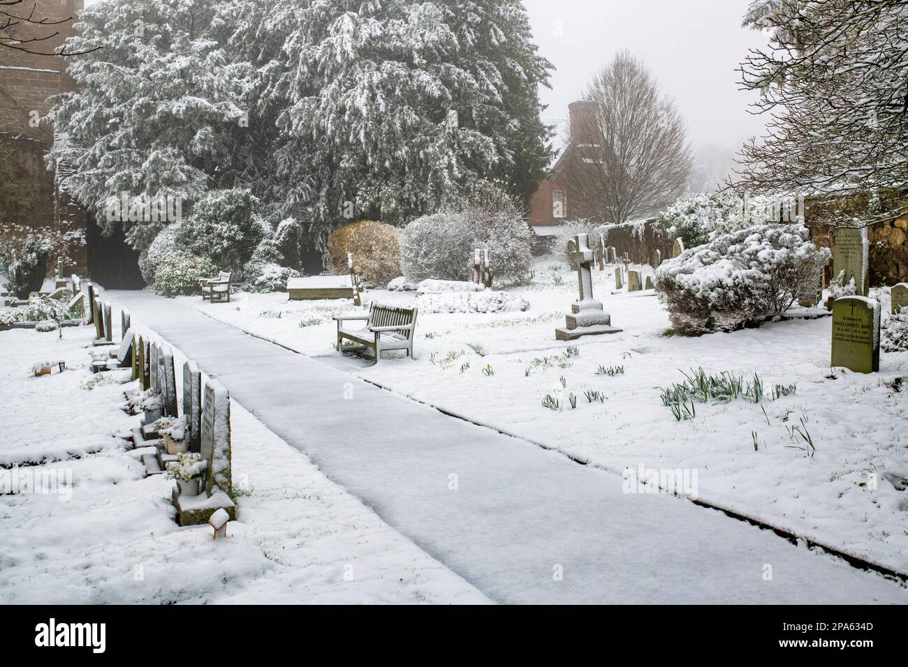 Little Malvern Priory and grounds in the march snow. Little Malvern ...
