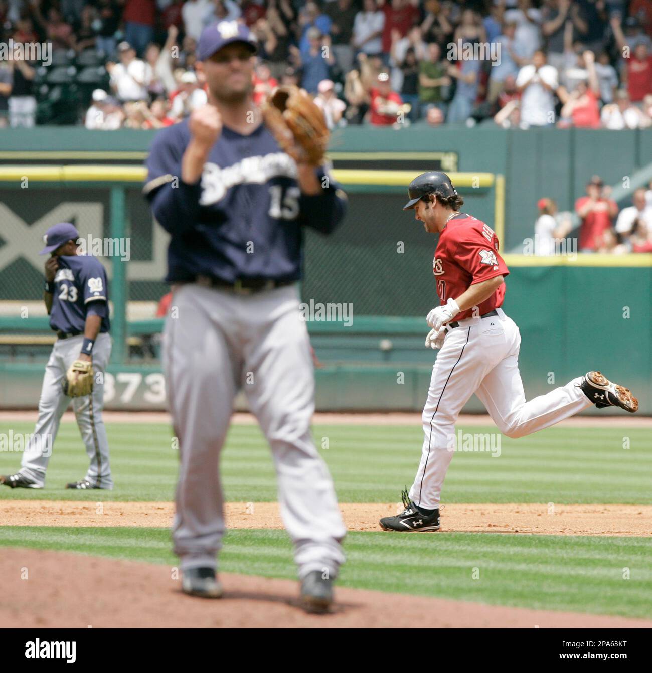 Houston Astros' Lance Berkman, right, runs the bases behind Milwaukee ...
