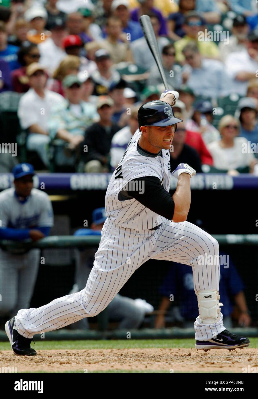 Colorado Rockies' Matt Holliday follows through with his swing after ...