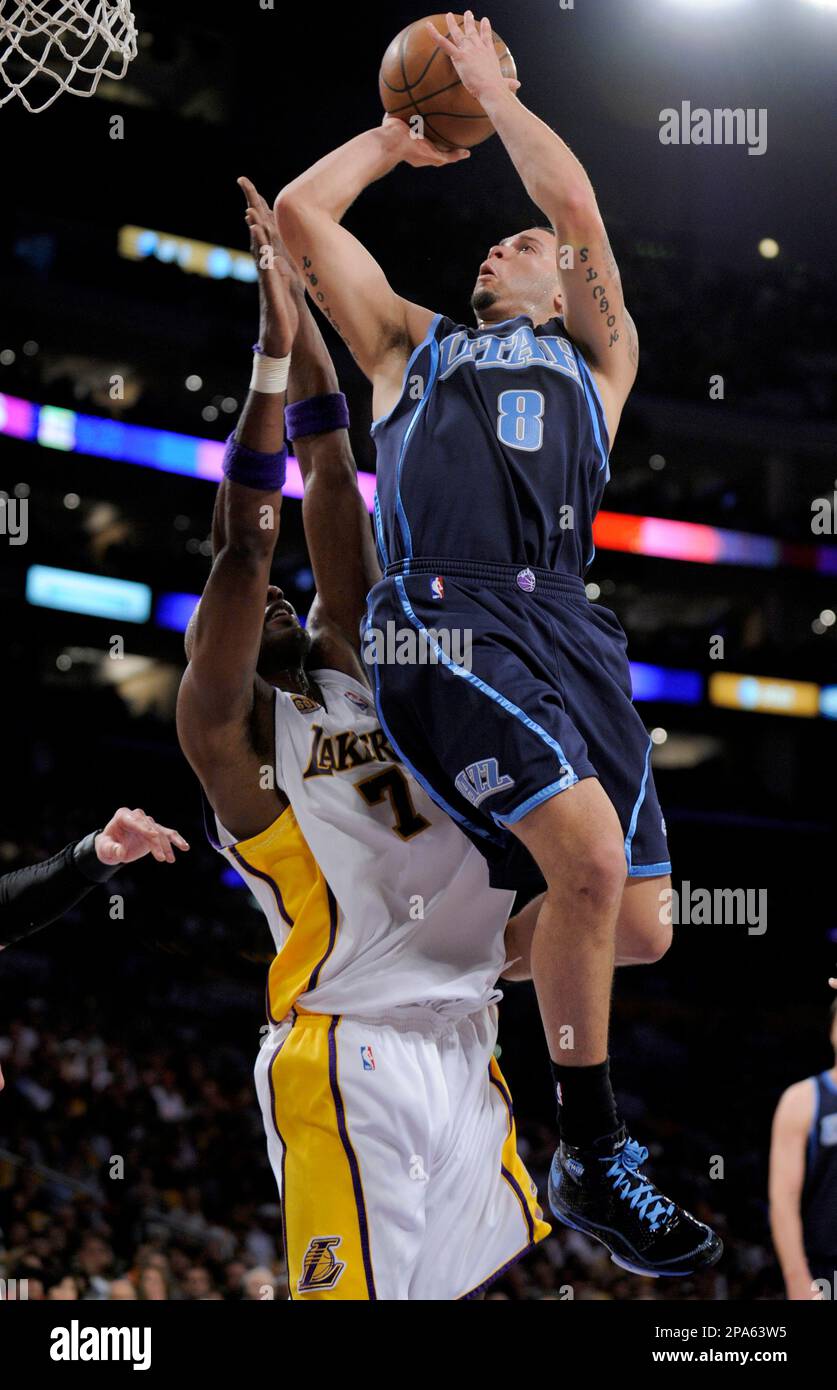 Utah Jazz forward Carlos Boozer shoots as Los Angeles Lakers forward ...