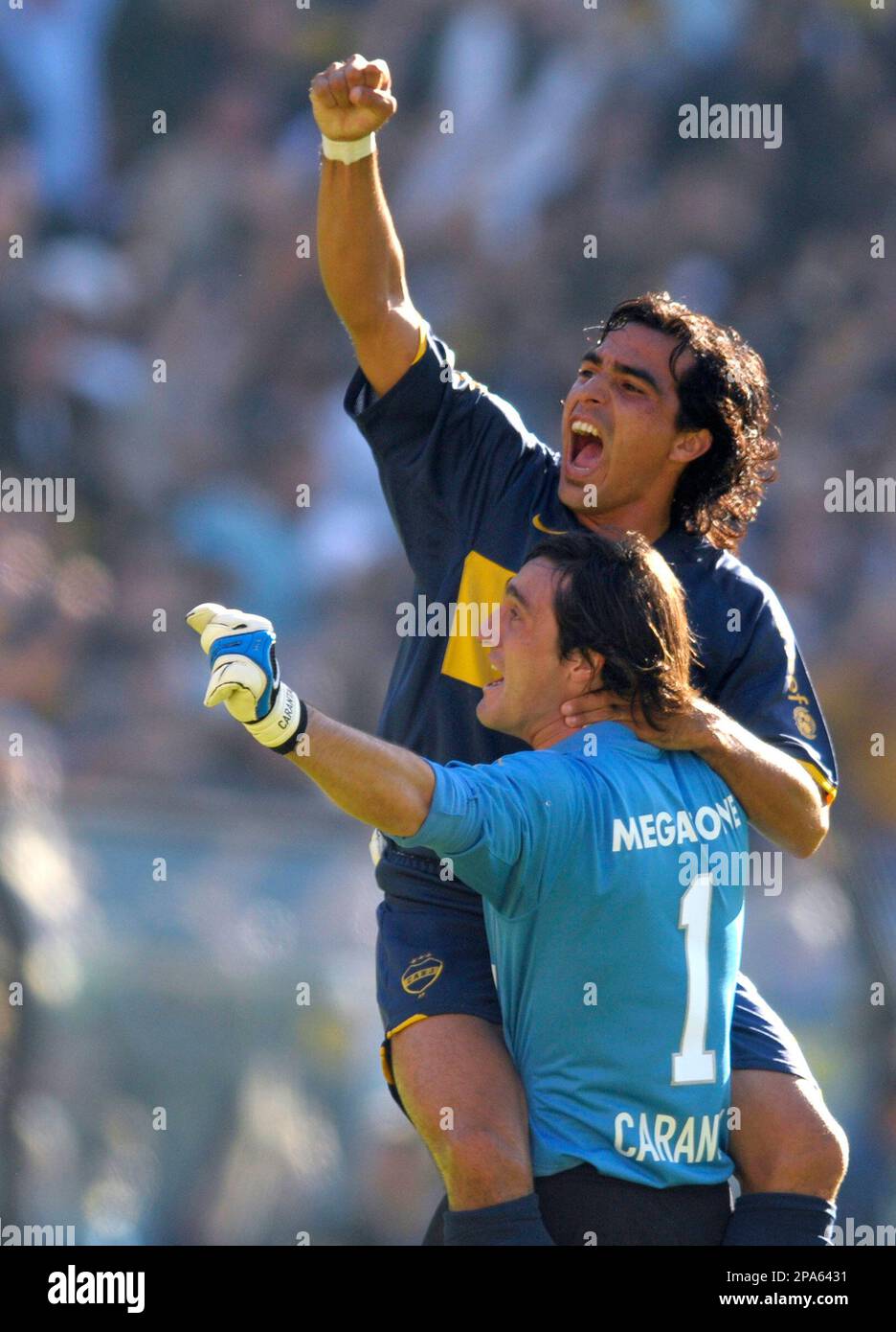 Boca Juniors' players Claudio Morel Rodriguez, top, from Paraguay, and ...