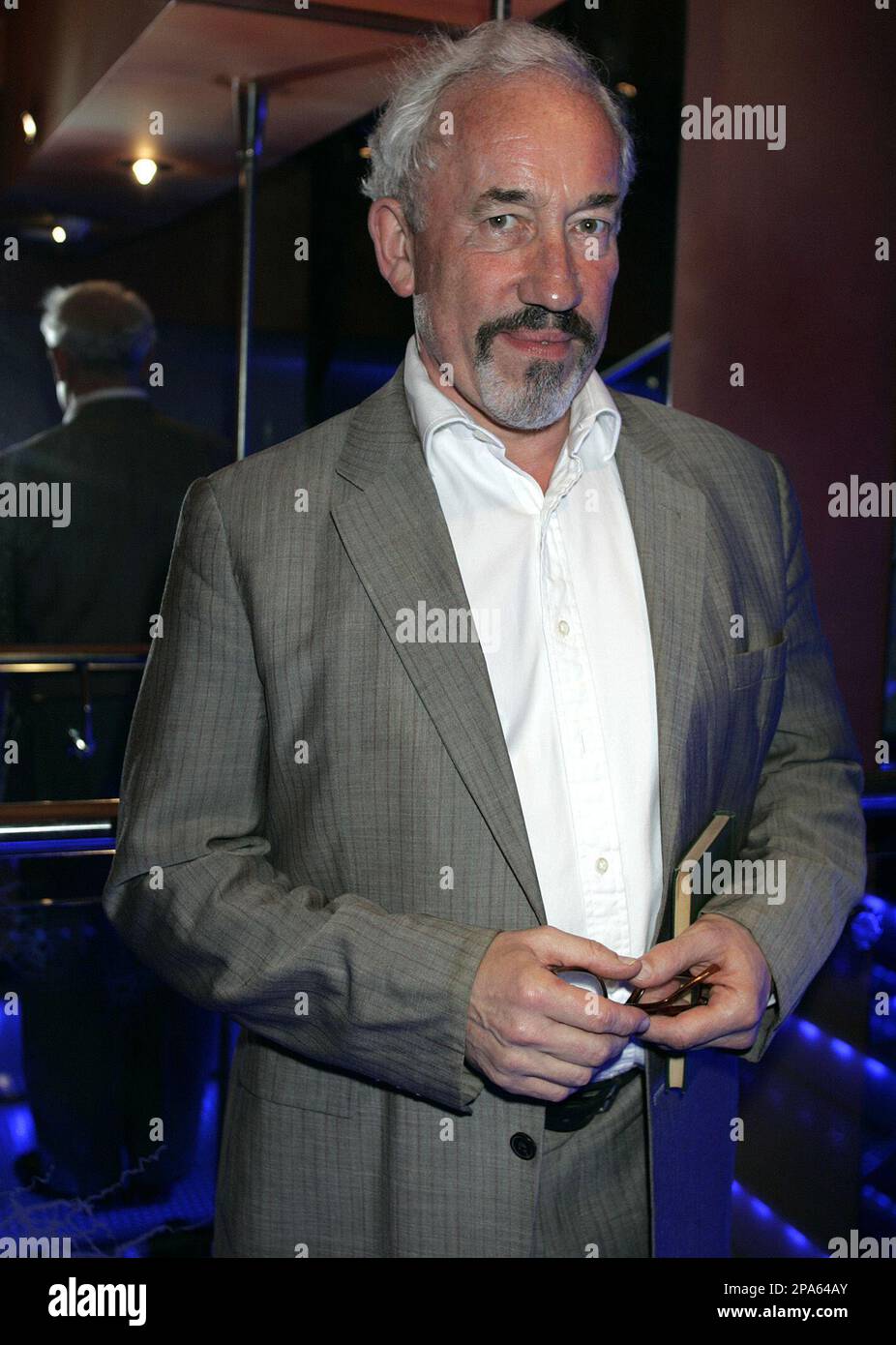 British actor Simon Callow poses for photographs as he arrives for the ...