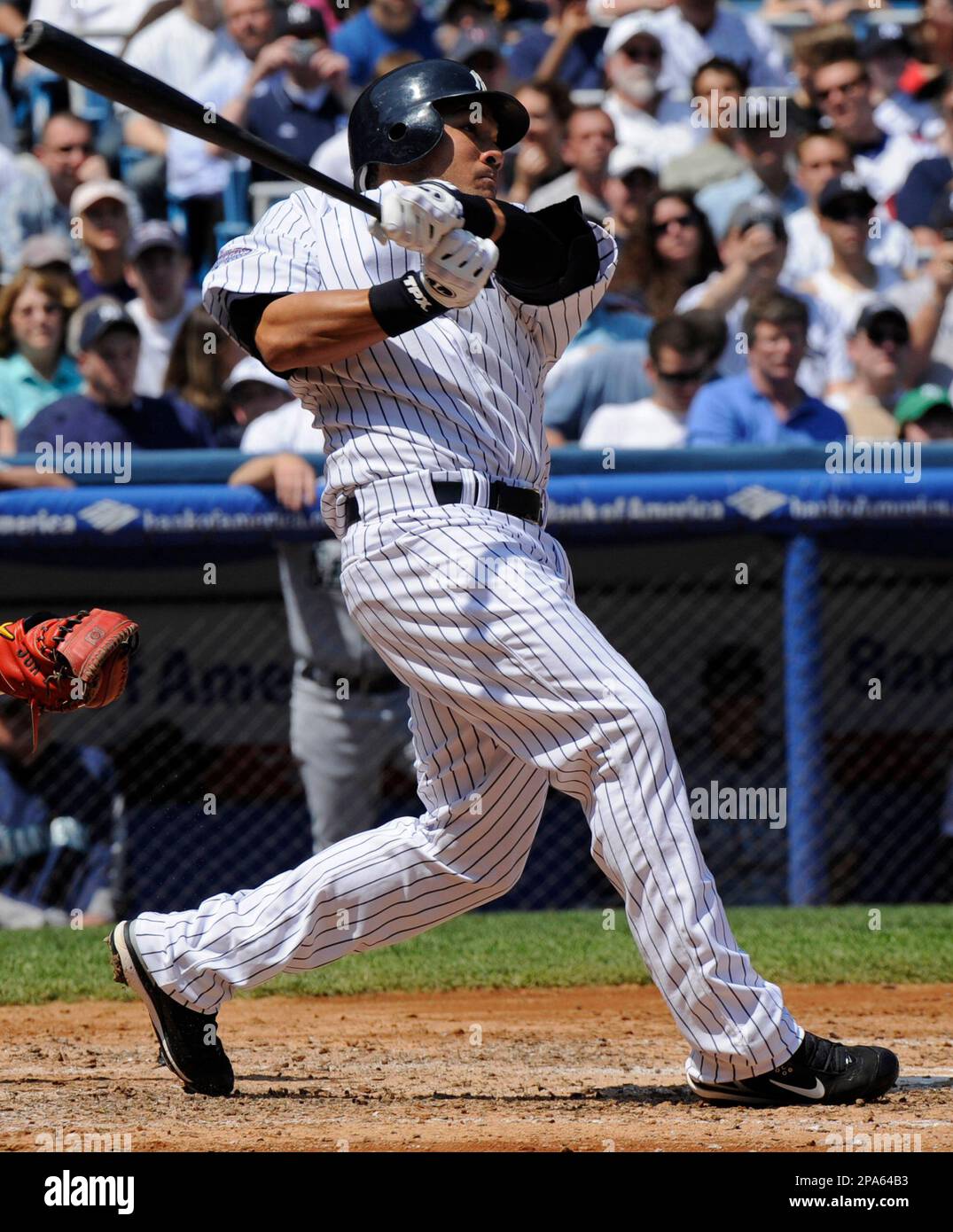 New York Yankees' Melky Cabrera follows through on his two-run home run ...