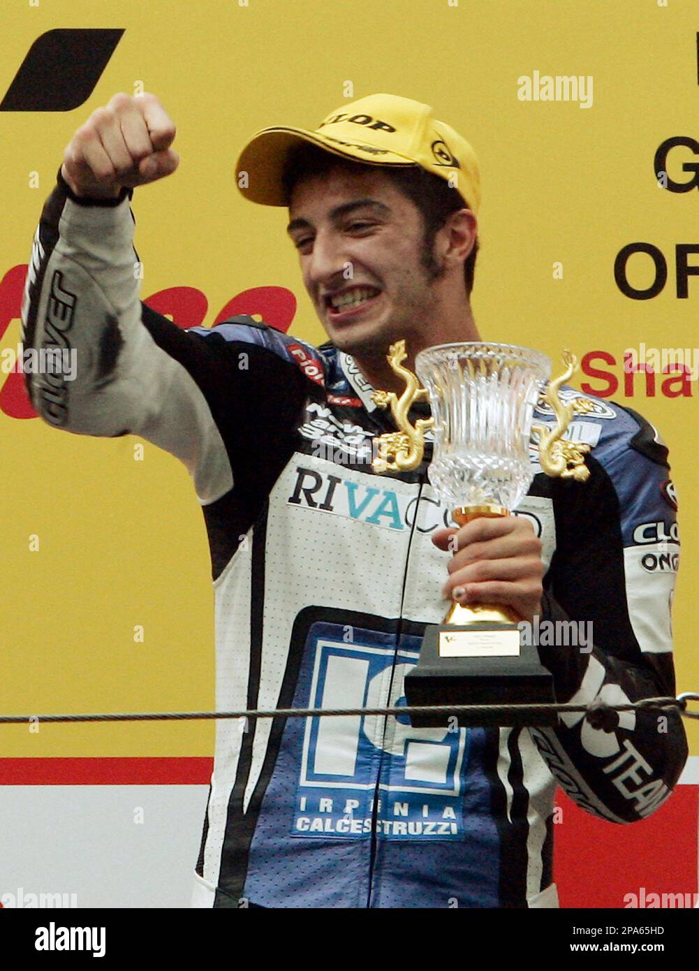 Italian 125cc class race rider Andrea Iannone celebrates with the ...