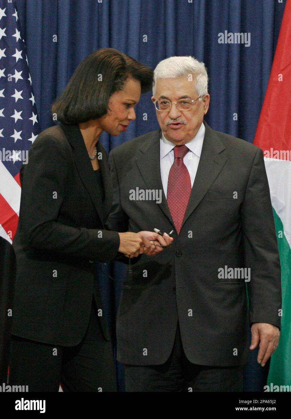 With U.S. and Palestinian flags seen in the background U.S. Secretary ...
