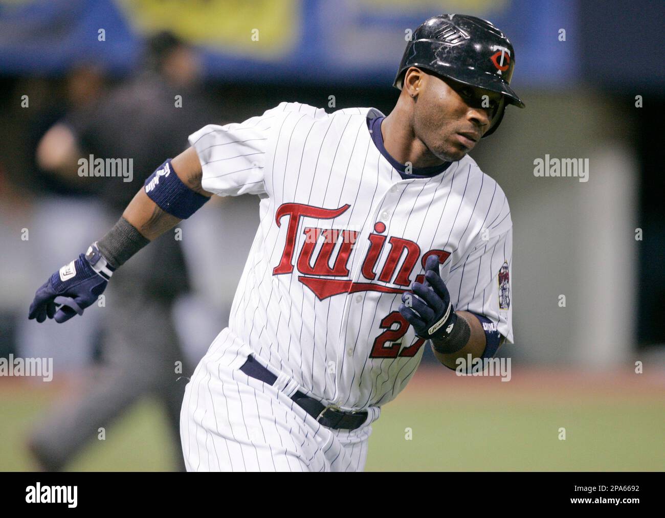 Minnesota Twins' Craig Monroe heads to first after hitting a two-run ...