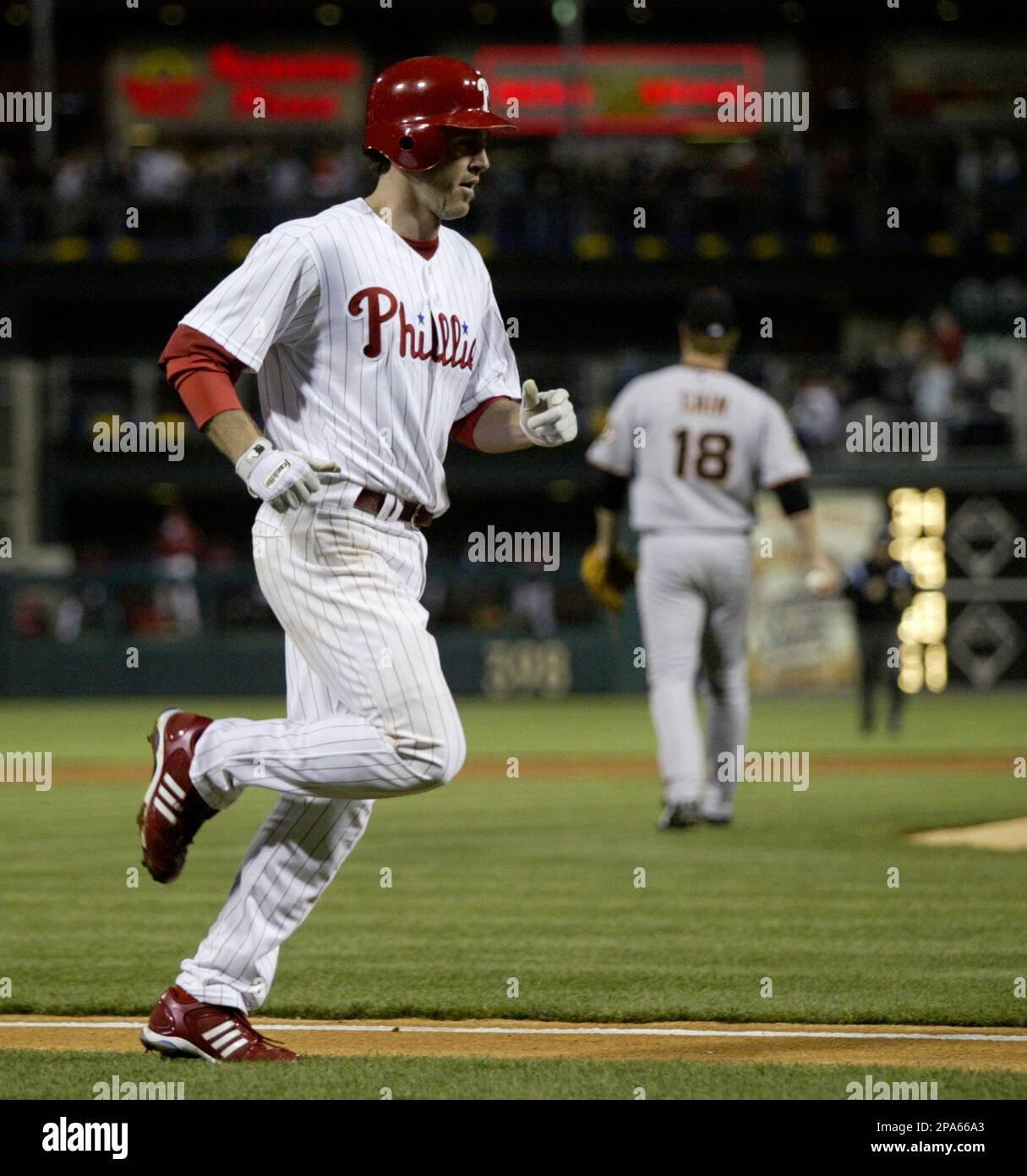Philadelphia Phillies' Chase Utley runs the bases after hitting a solo ...