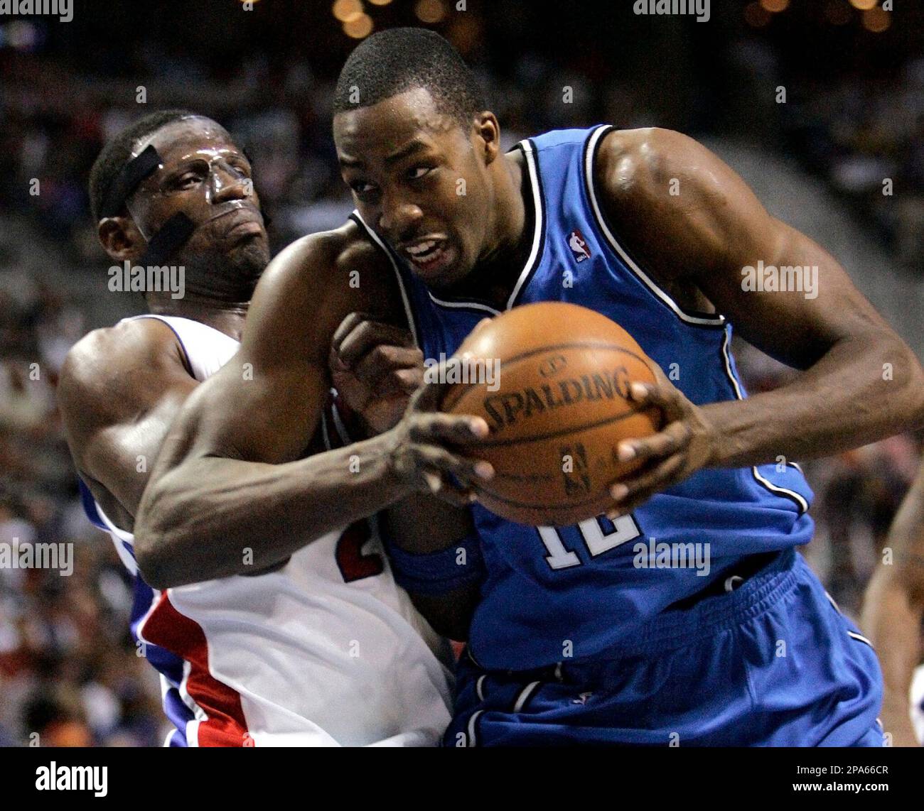 Orlando Magic center Dwight Howard, right, drives on Detroit Pistons ...