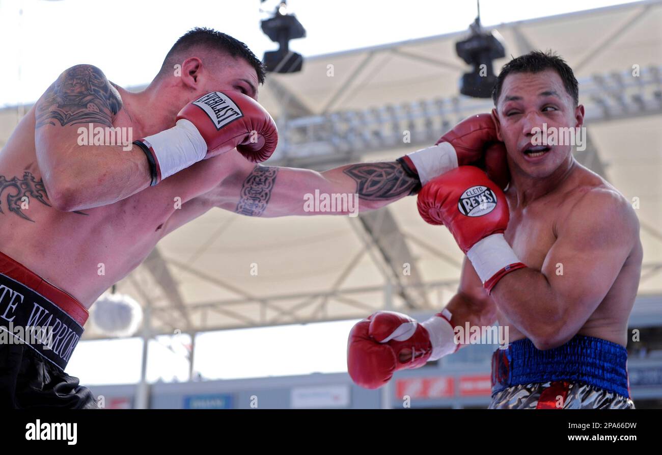 Sven Paris, left, of Italy, lands a punch on Freddy Curiel during their ...