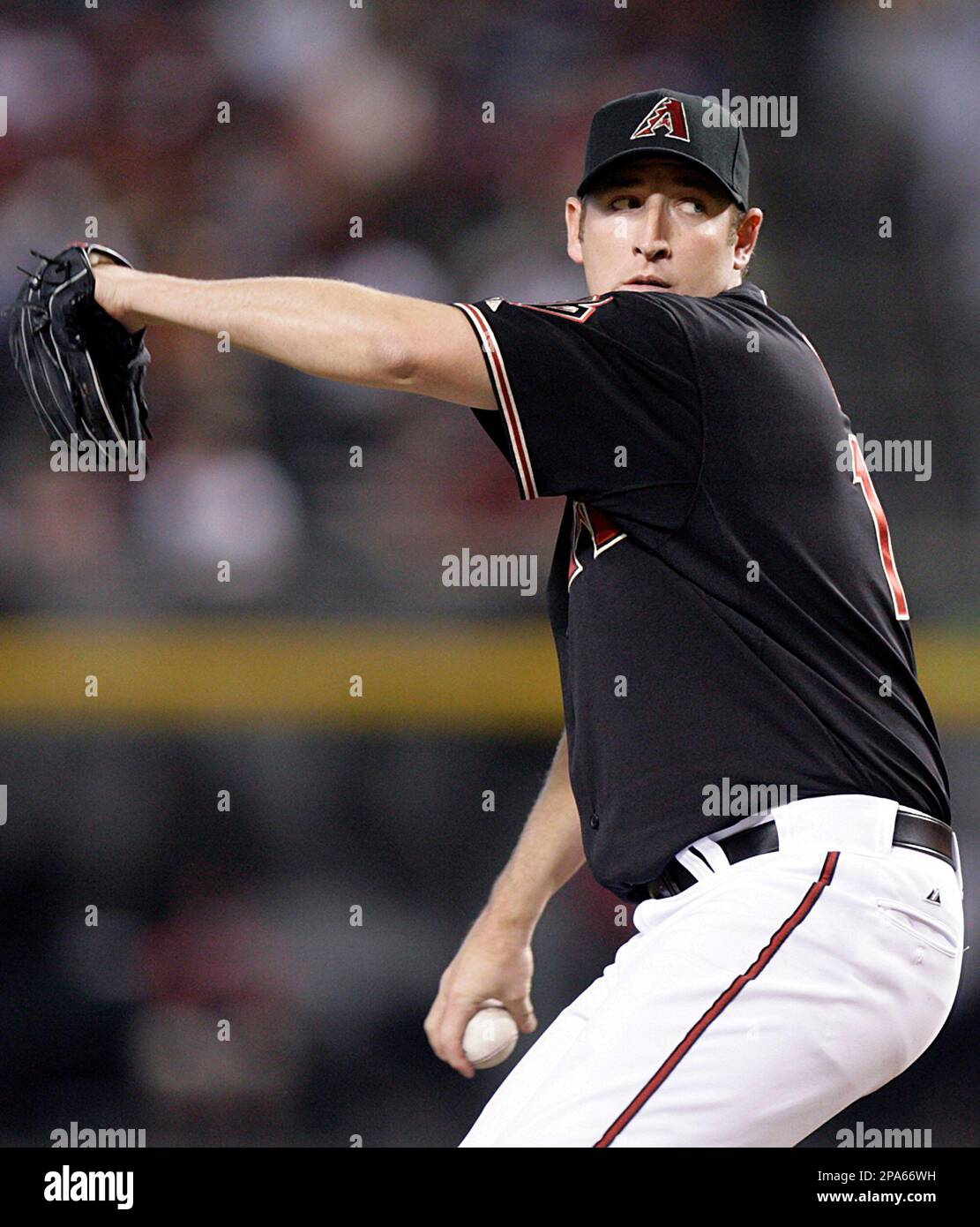 Arizona Diamondbacks pitcher Brandon Webb winds up to deliver a pitch ...