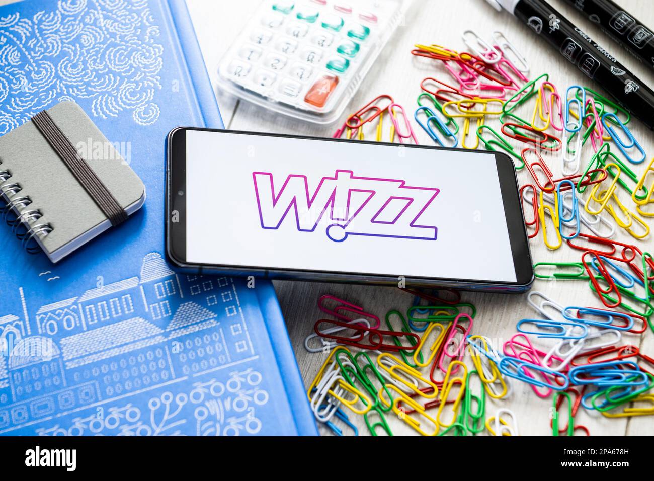 In this photo illustration a Wizz Air logo seen displayed on a ...