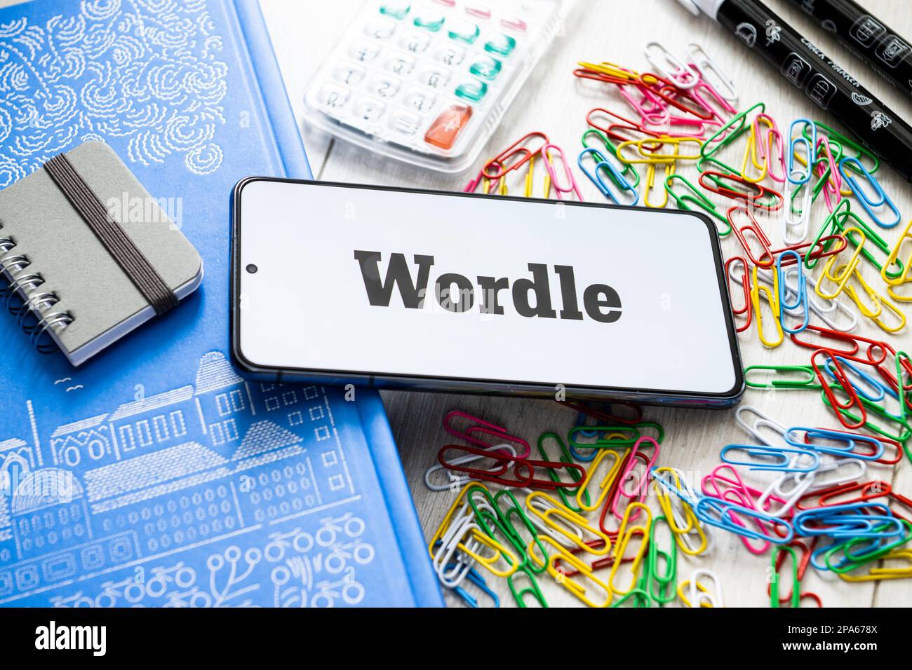 In this photo illustration a Wordle logo seen displayed on a smartphone ...