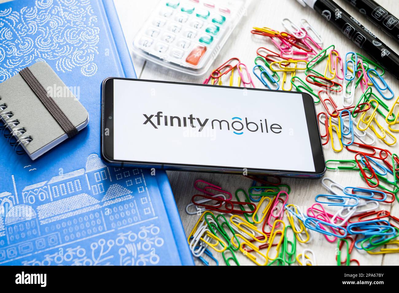 In this photo illustration a Xfinity Mobile logo seen displayed on a ...