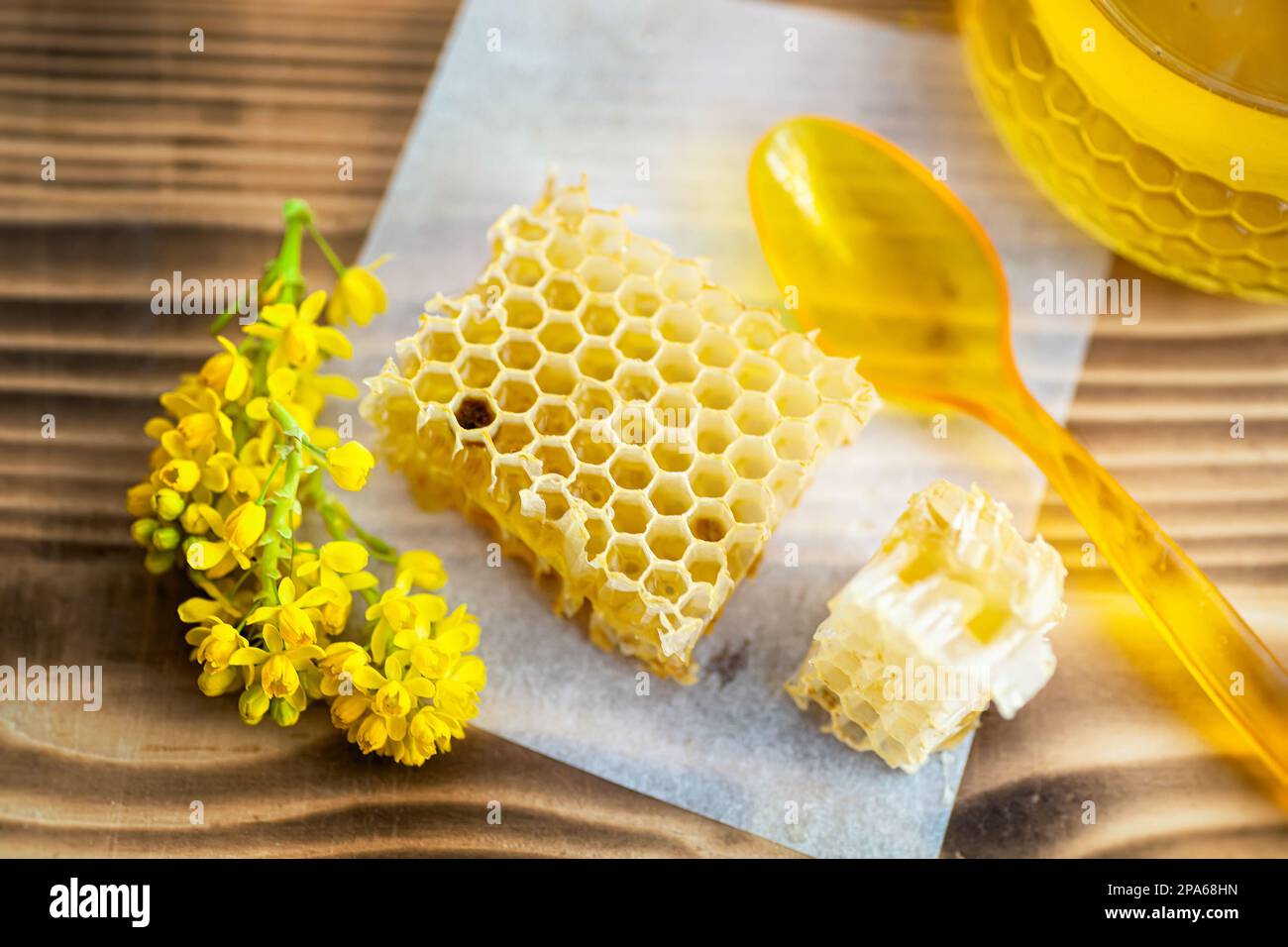 broken yellow honeycomb with honey on table. Honey products. healthy ...