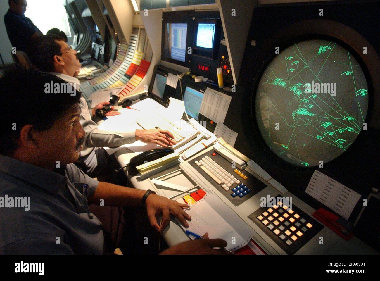 FILE *** Radar operators work in the radar room at Qatar International ...