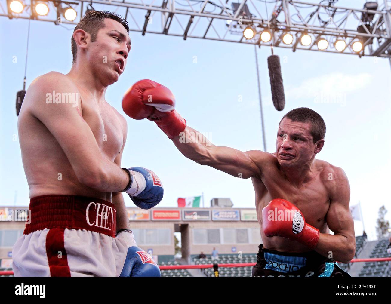 Roberto Arrieta, right, of Argentina, throws a punch at Vicente ...