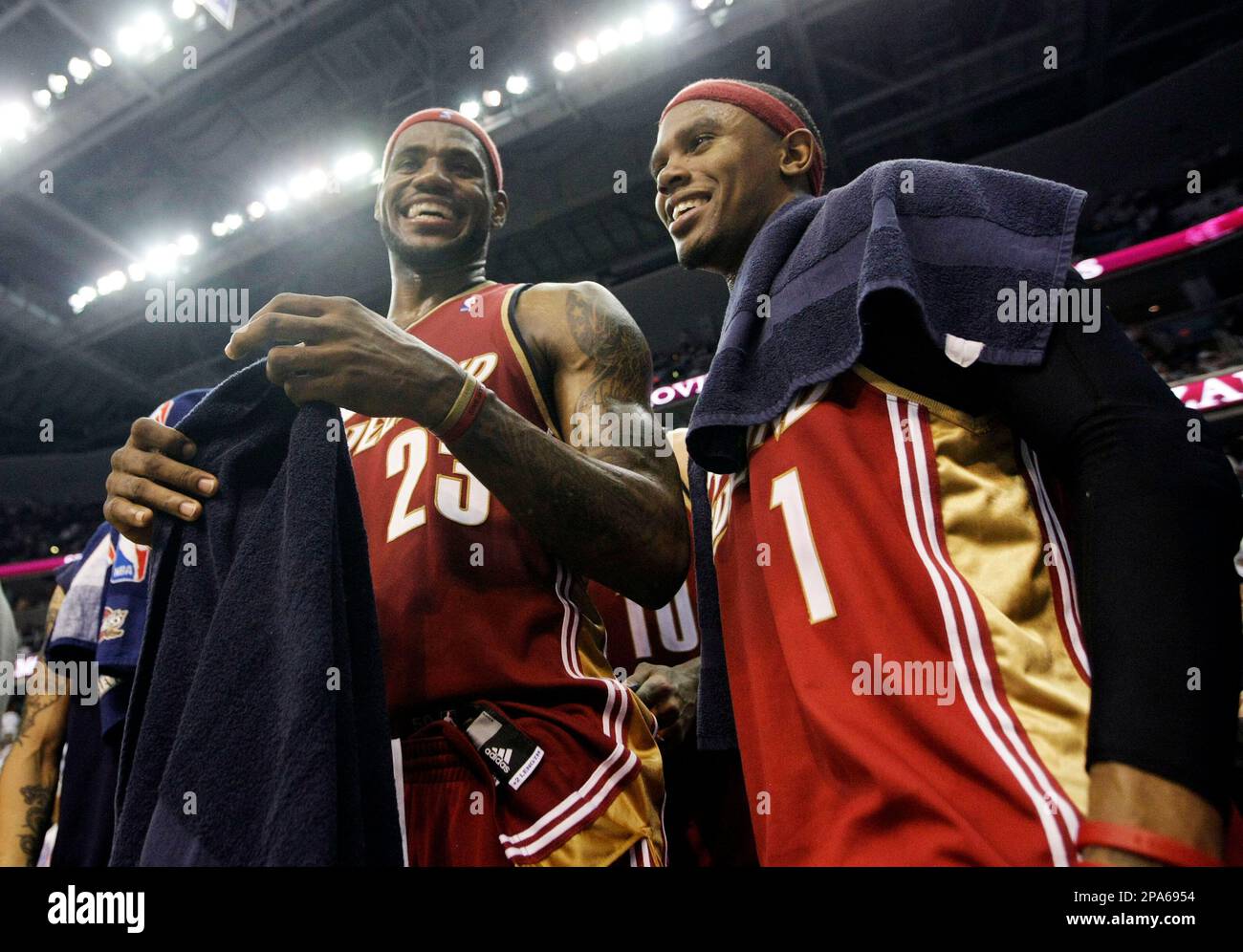Cleveland Cavaliers' LeBron James, left, and Daniel Gibson (1) smile in ...