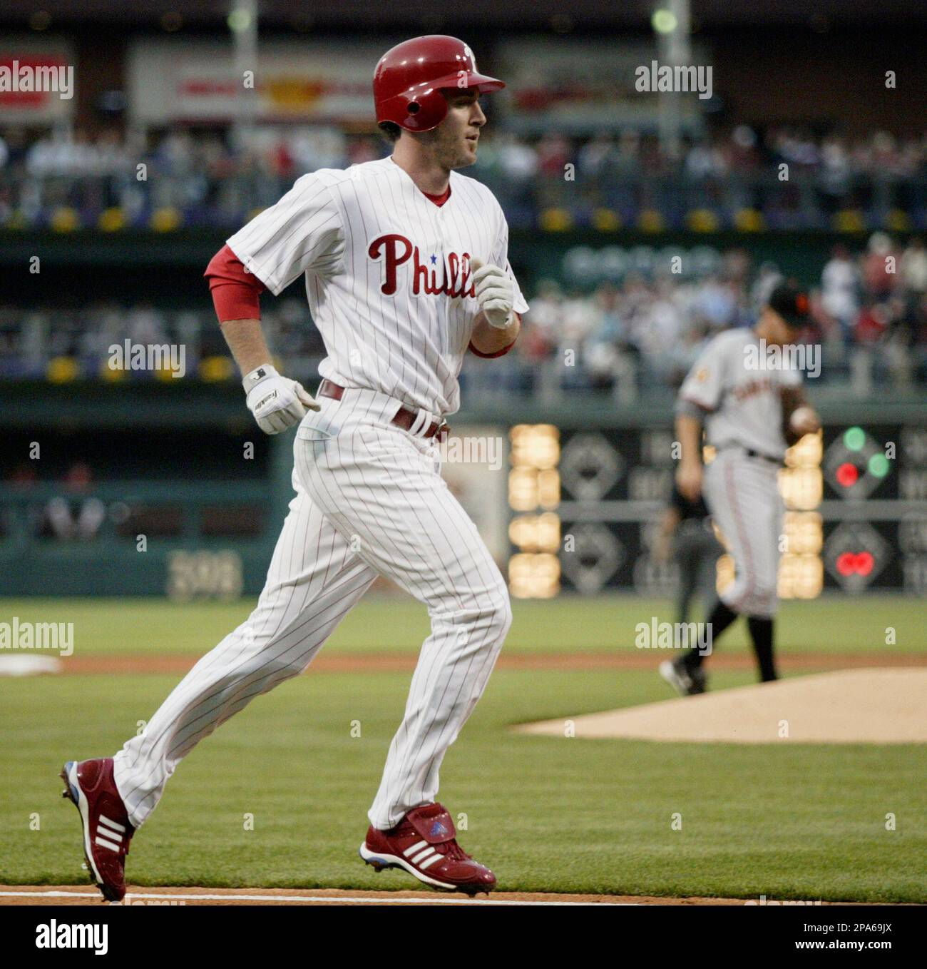 Philadelphia Phillies' Chase Utley runs the bases after he hit a two ...